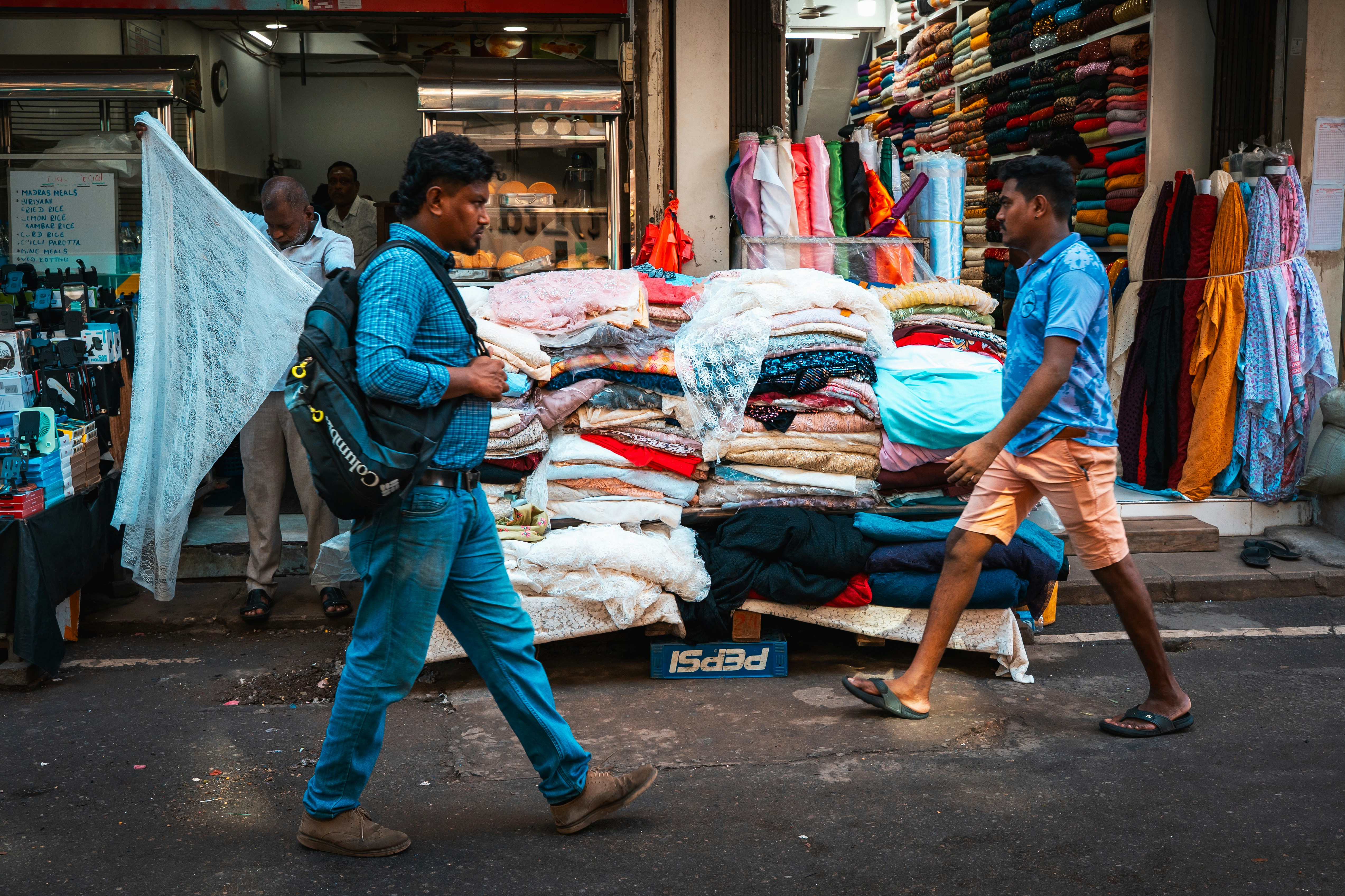 Morning Street Cloth Market: Faces, Fabrics, and Foot Traffic