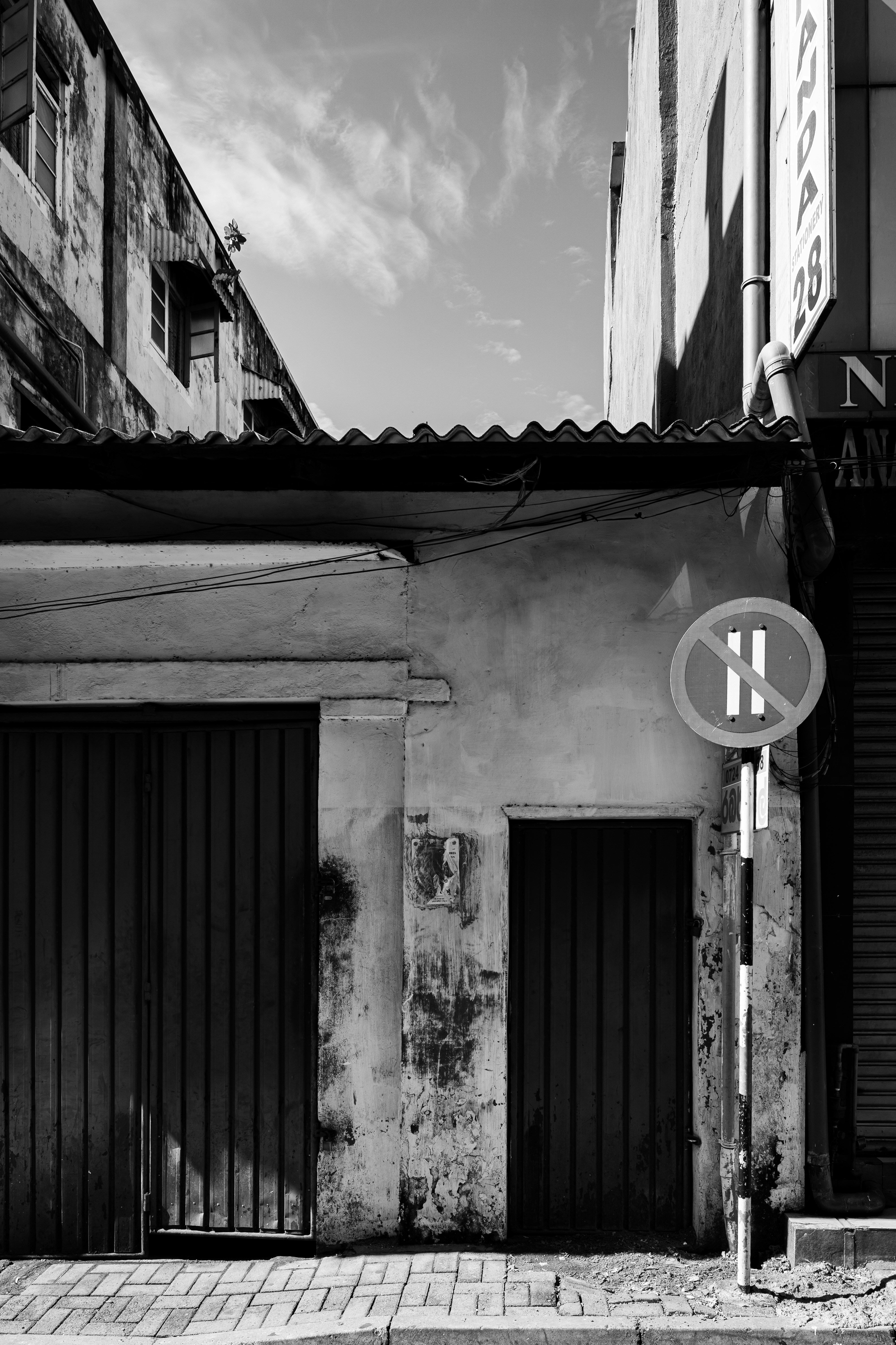 Weathered Facade and No-Entry Sign: A Quiet Urban Quietude
