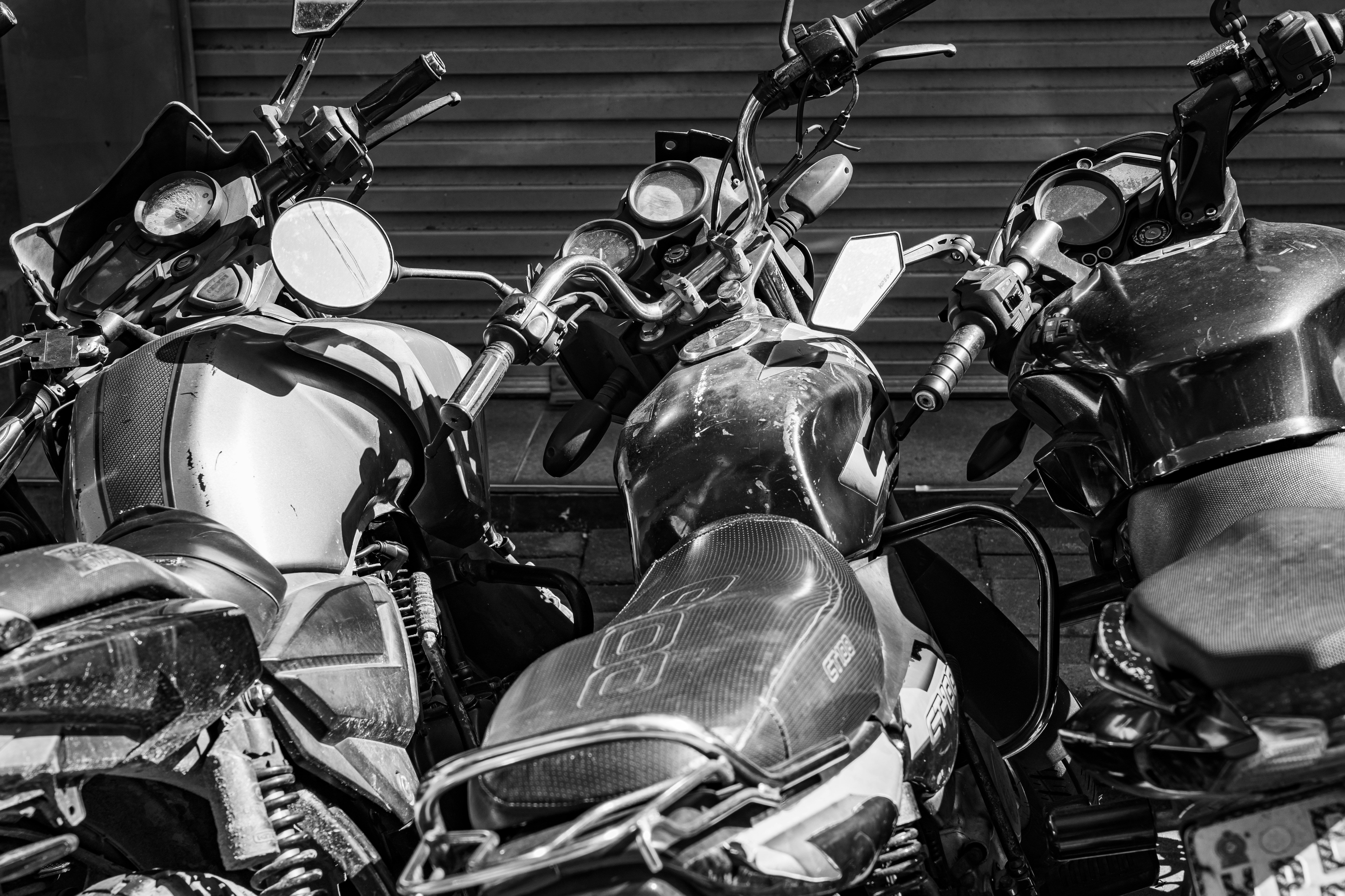 Line of Rigid Steel: A Row of Motorcycles Frozen in Monochrome