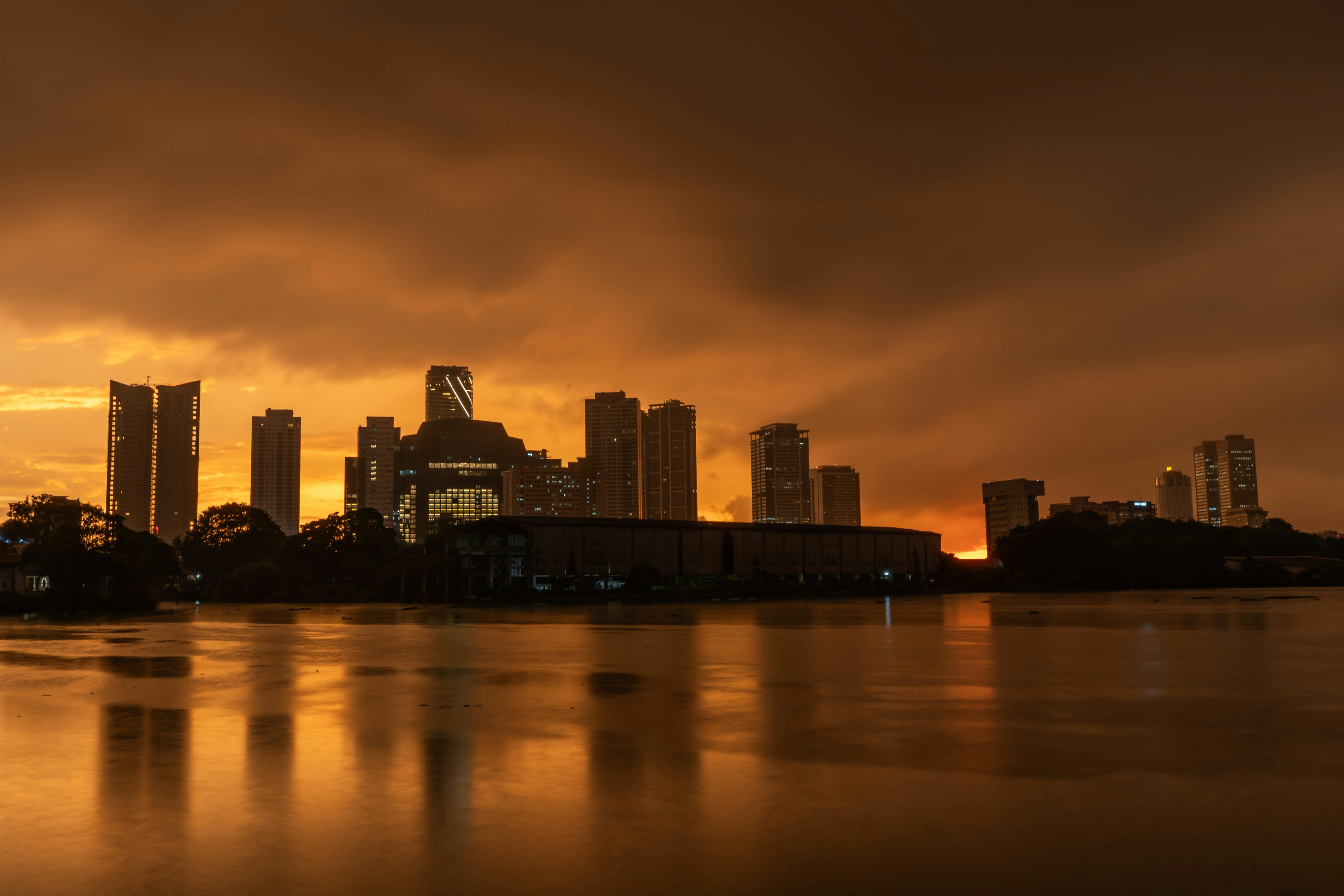 Golden Hour Skyline: Reflections over a Quiet Water