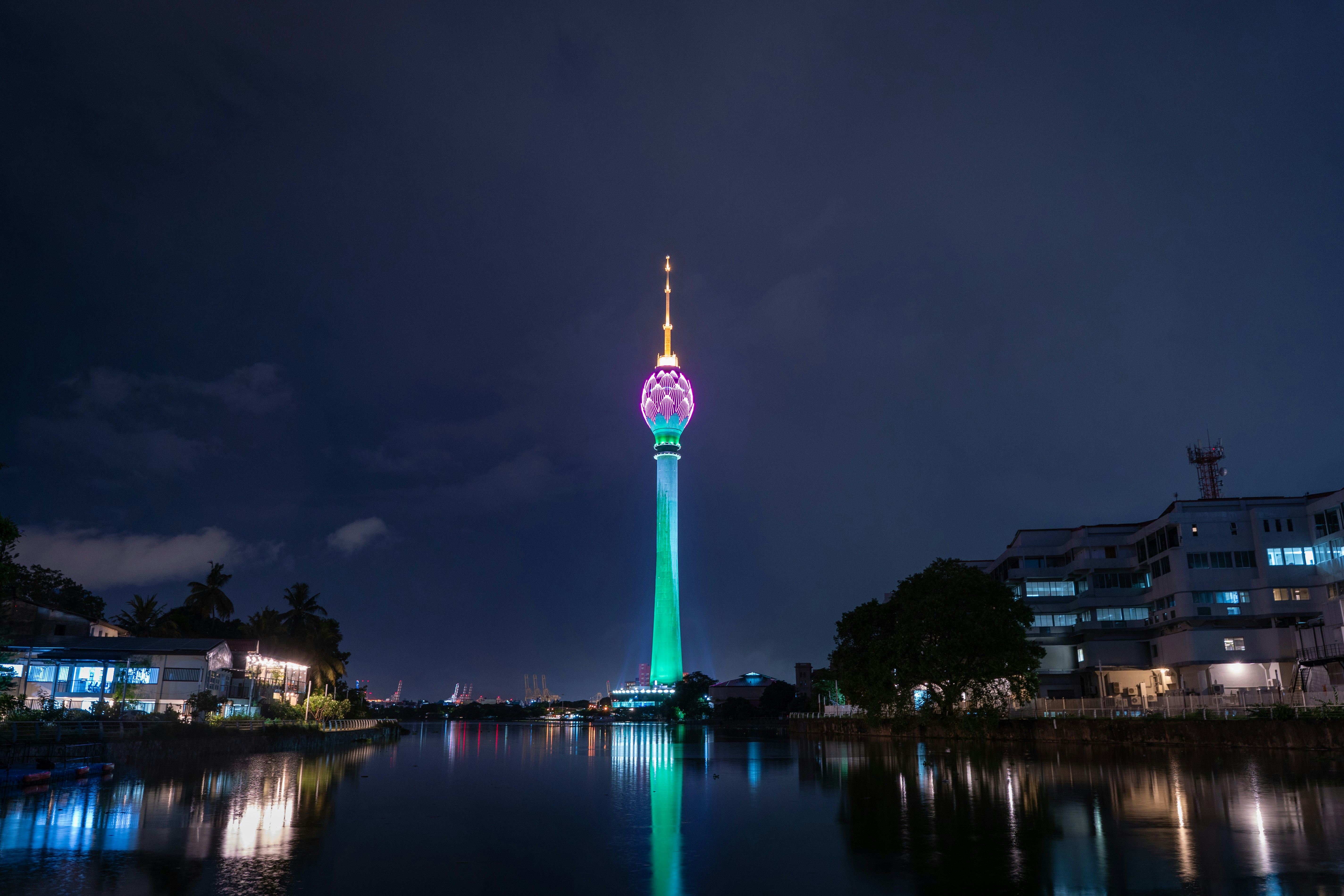 Neon Needle Over Quiet Waters