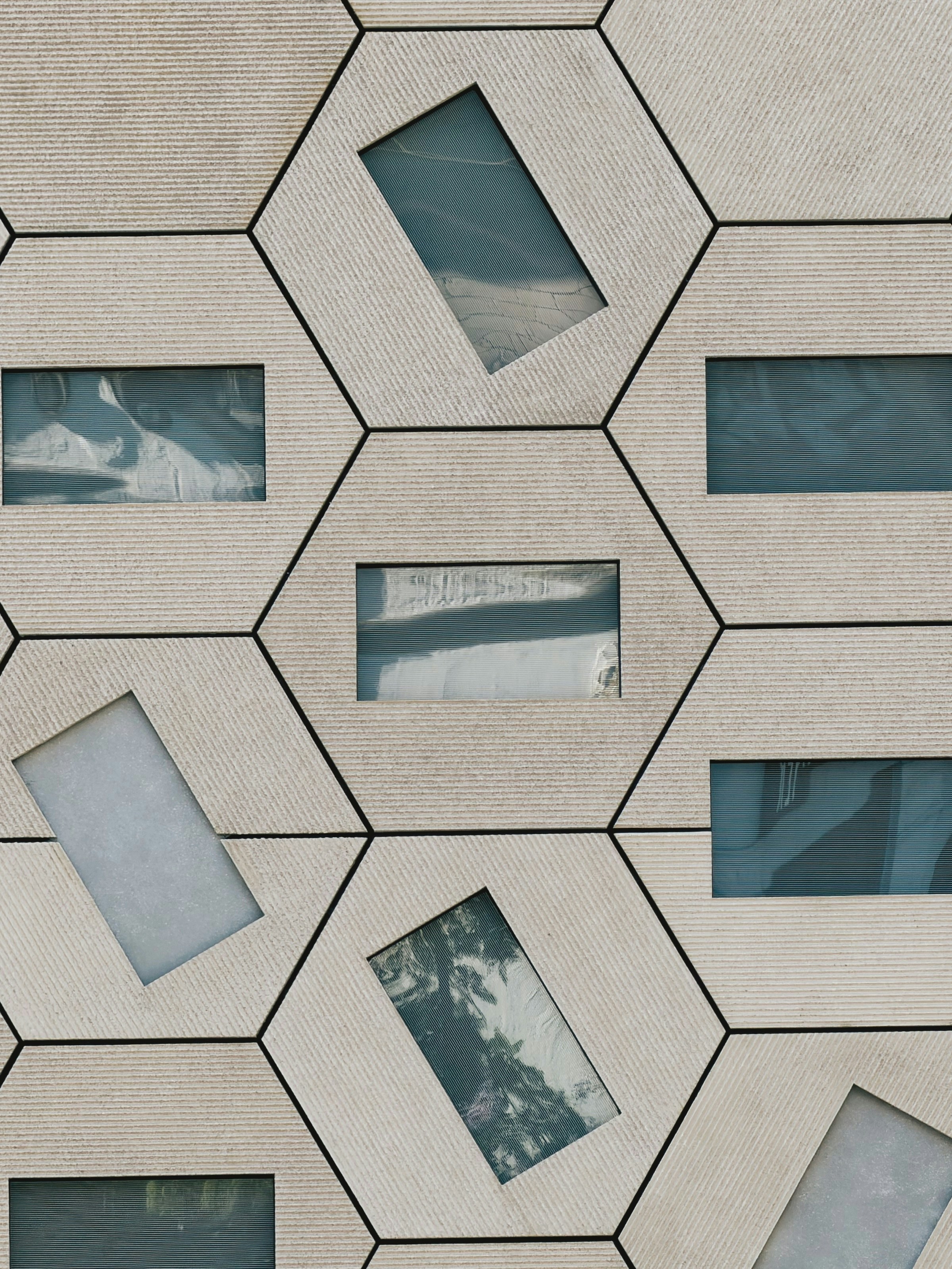 Hexagonal Facade: Windows Set in a Diamond Grid