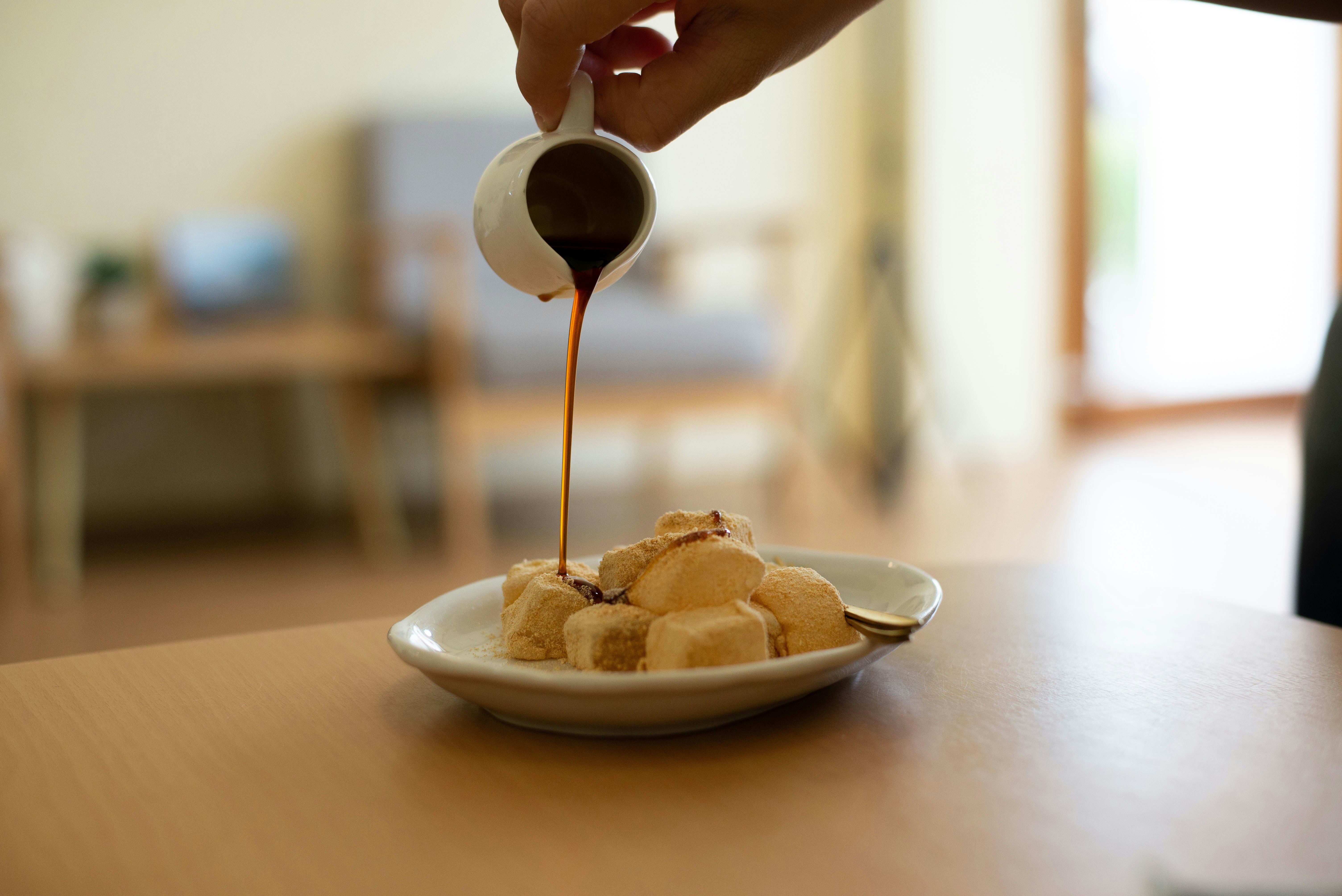 Pouring Sweet Focus: Espresso of Caramel Drizzle over Sugar Tufts