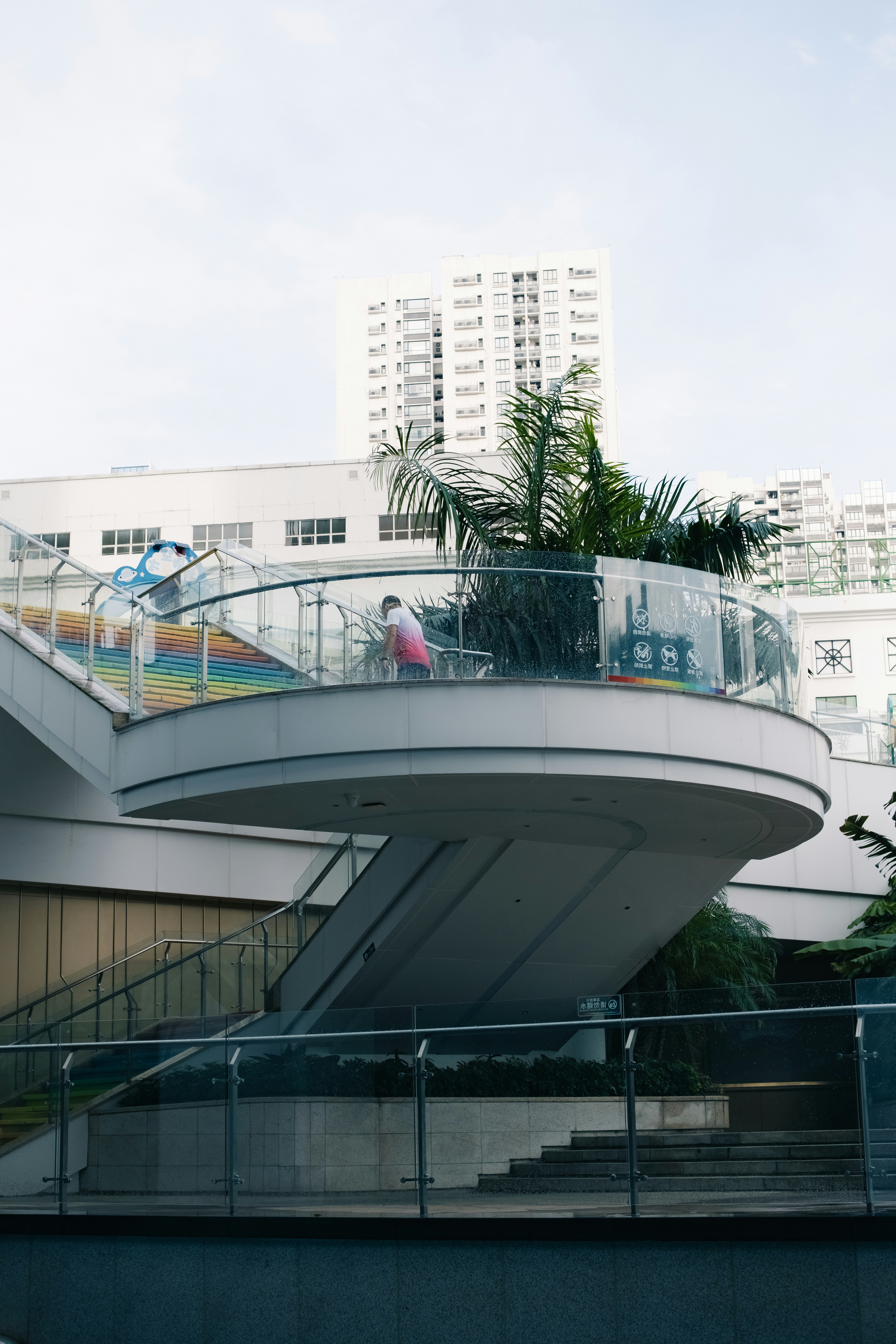 Curved Skywalk Over Urban Steps