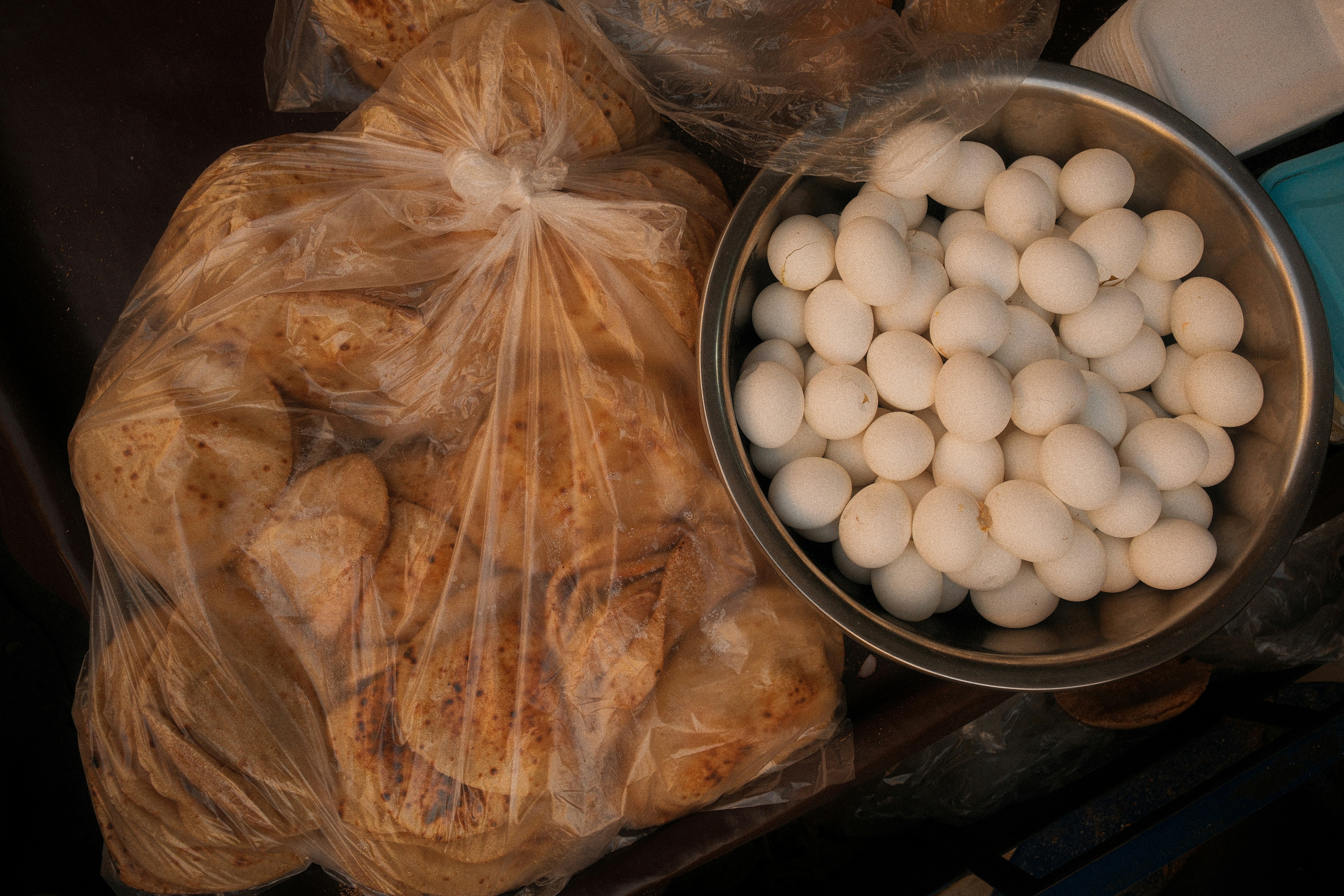 Bowl of Eggs and Bagged Pastries: Crunch, Contrast, and Color in a Street Market