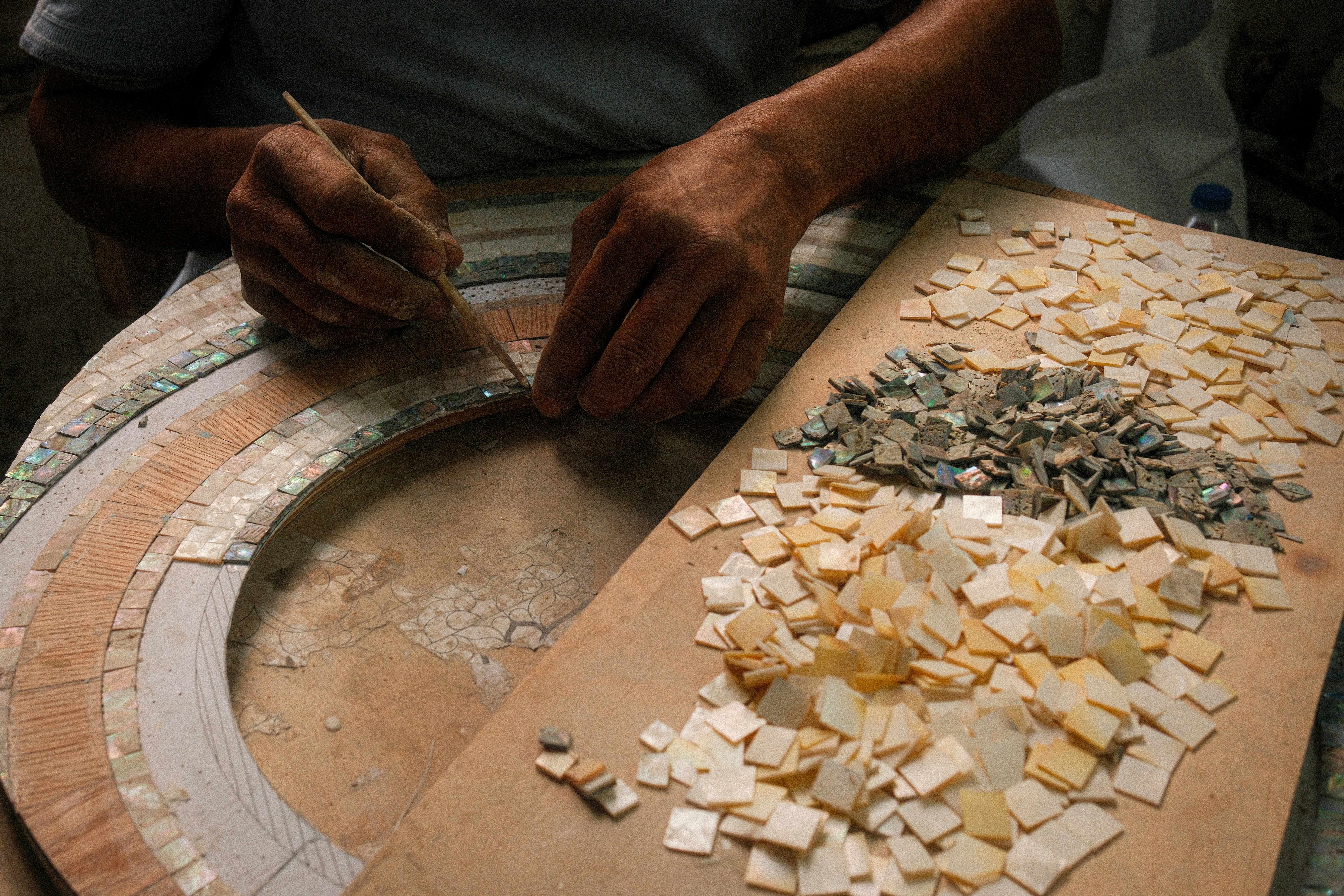 Hands at Work: Crafting a Mosaic from Tiny Tiles