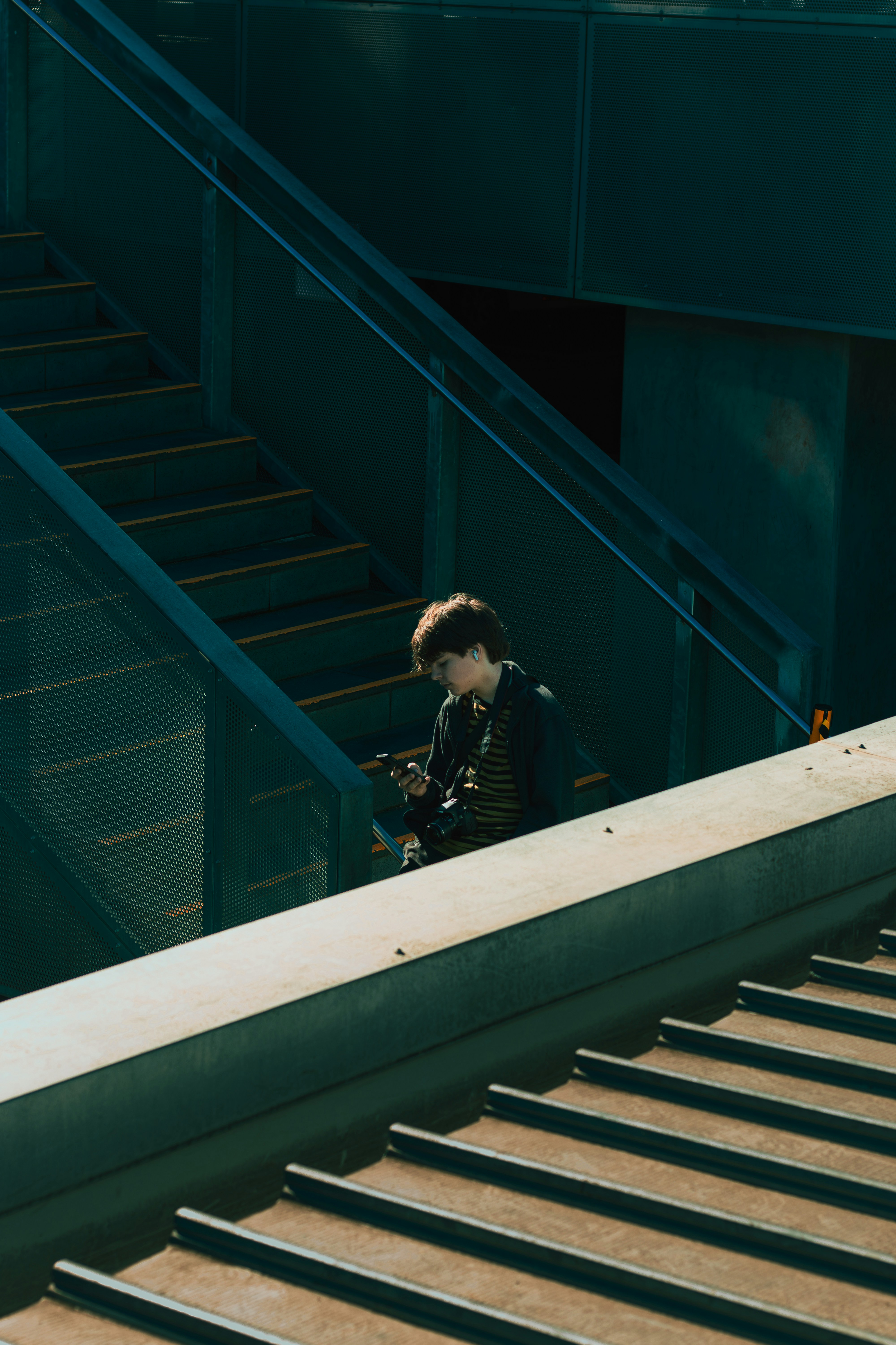 Lone Photographer on a Skyward Stairwell