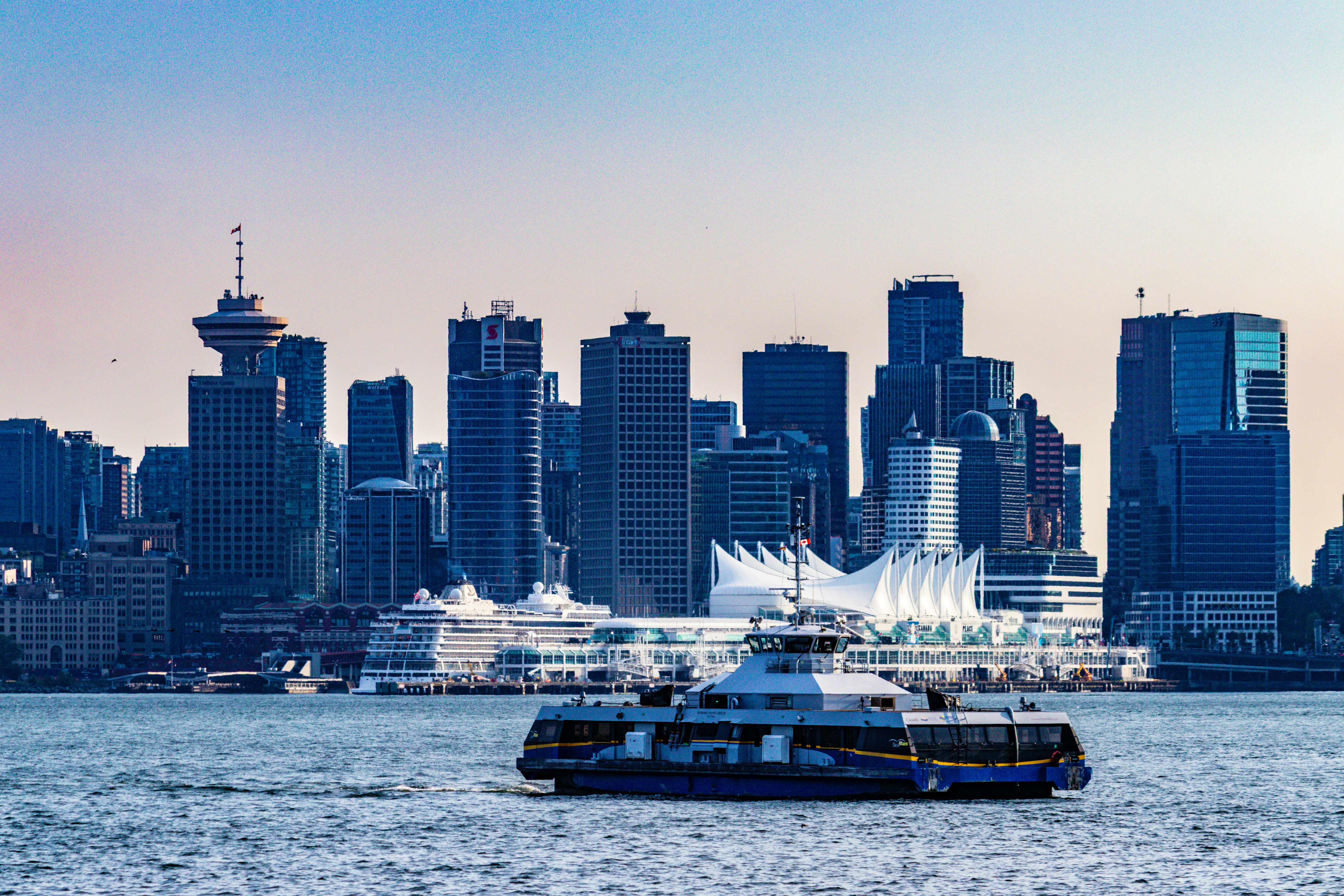 Harbor View: City Skyline and Ferry in Motion