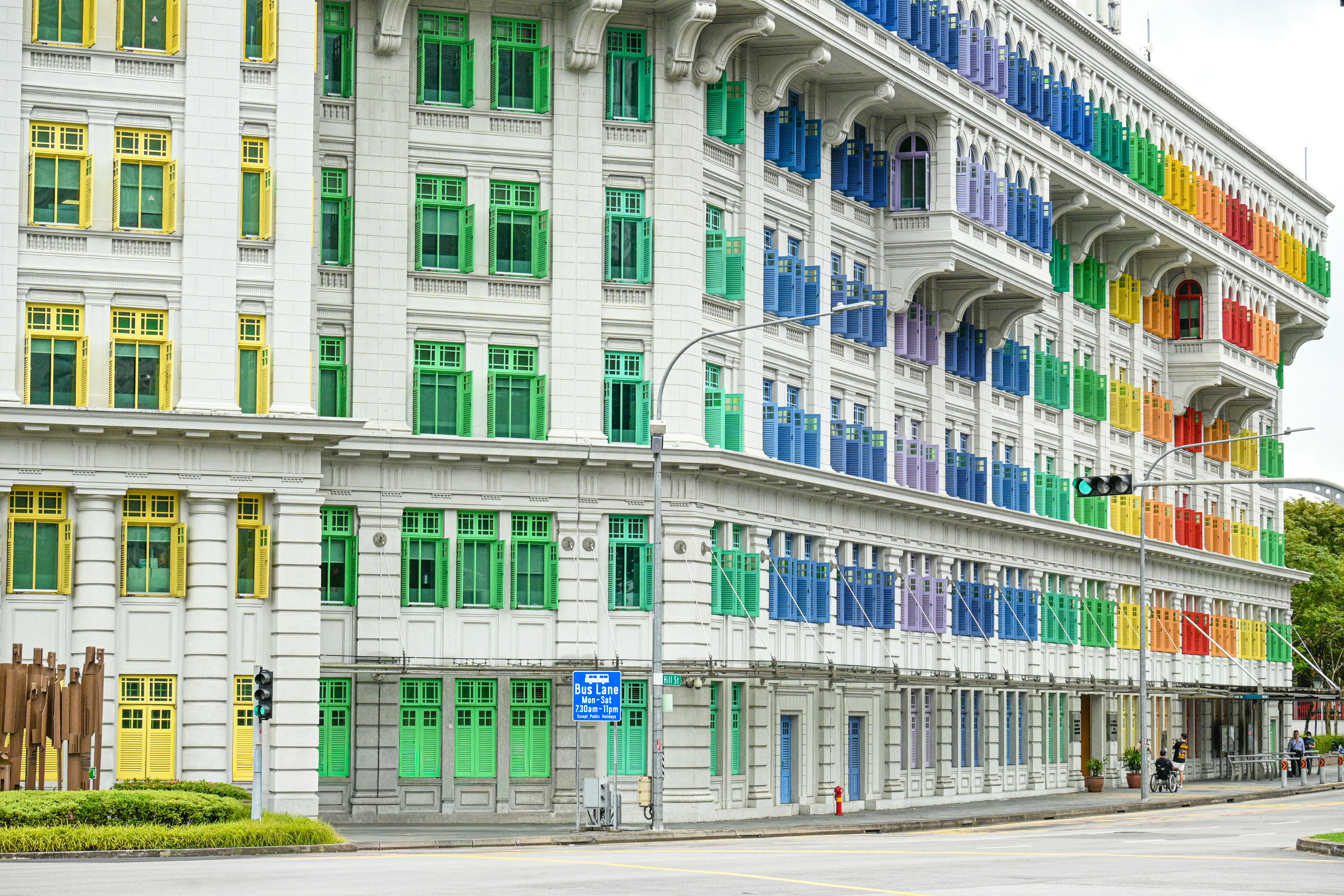 Chromatic Facade: A Rainbow of Windows on a Classical Street