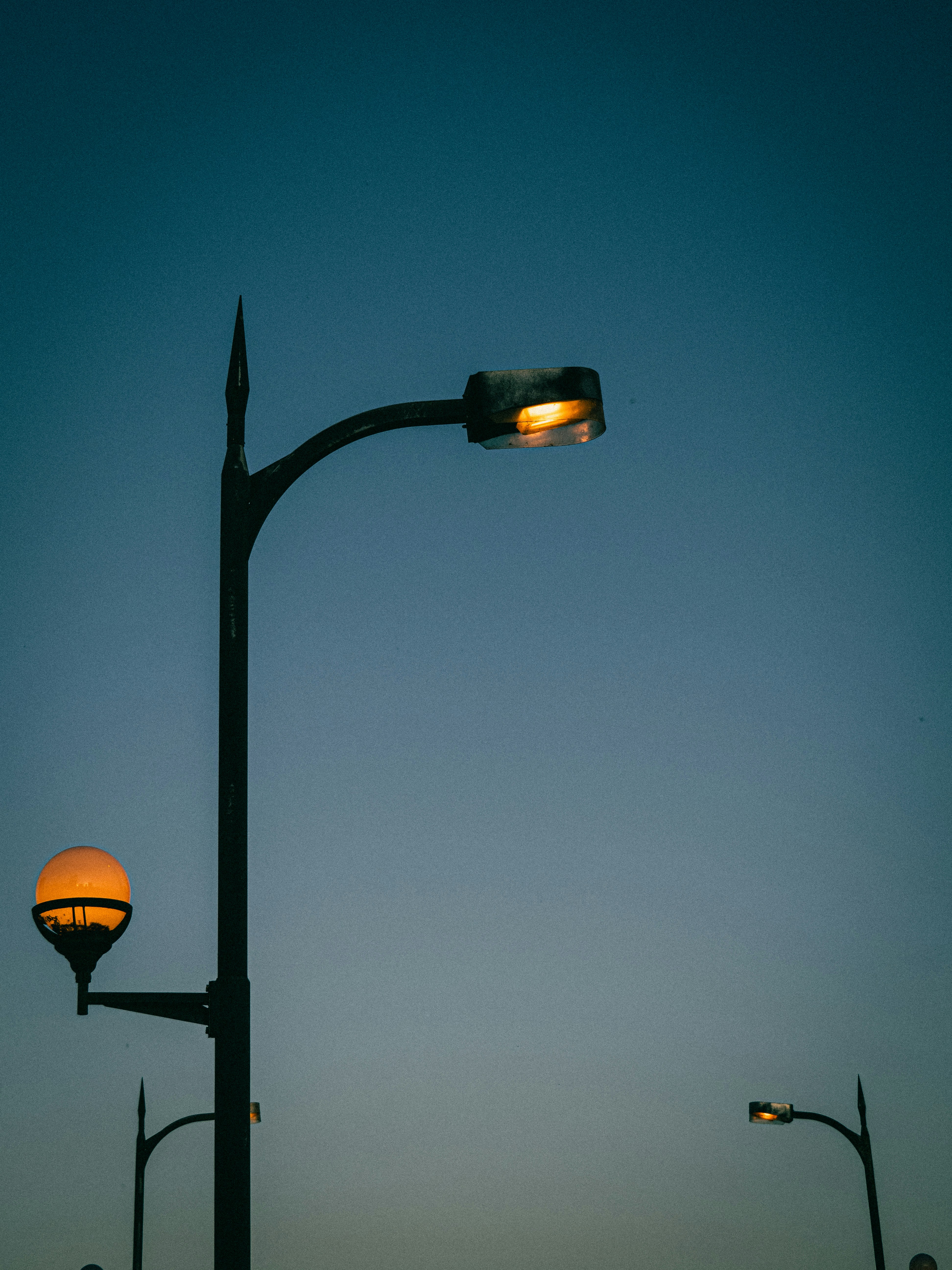 A Quiet Confluence of Street Lamps at Dusk