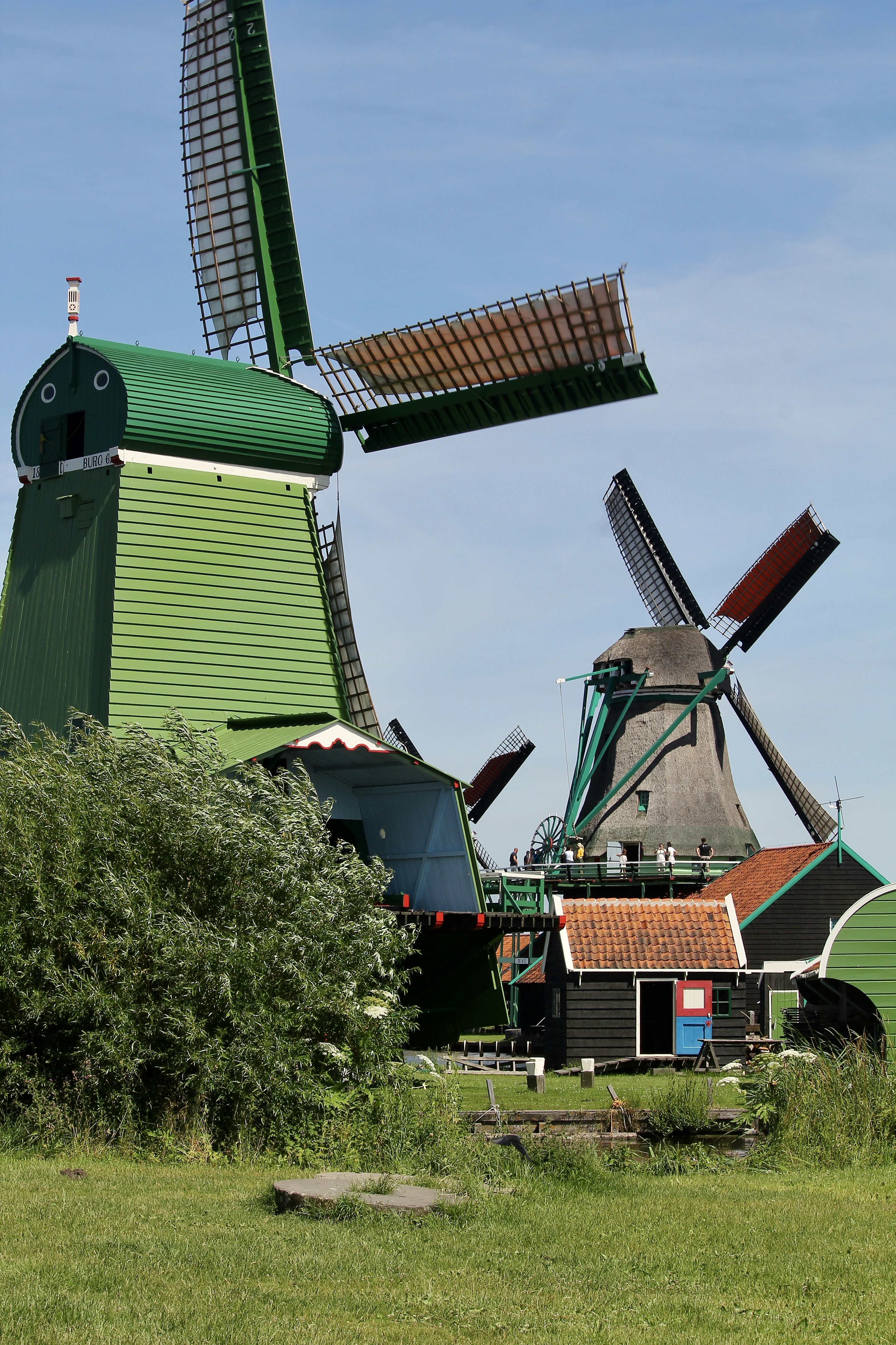 Rotating Giants: Dutch Windmills Against a Clear Delft-blue Sky