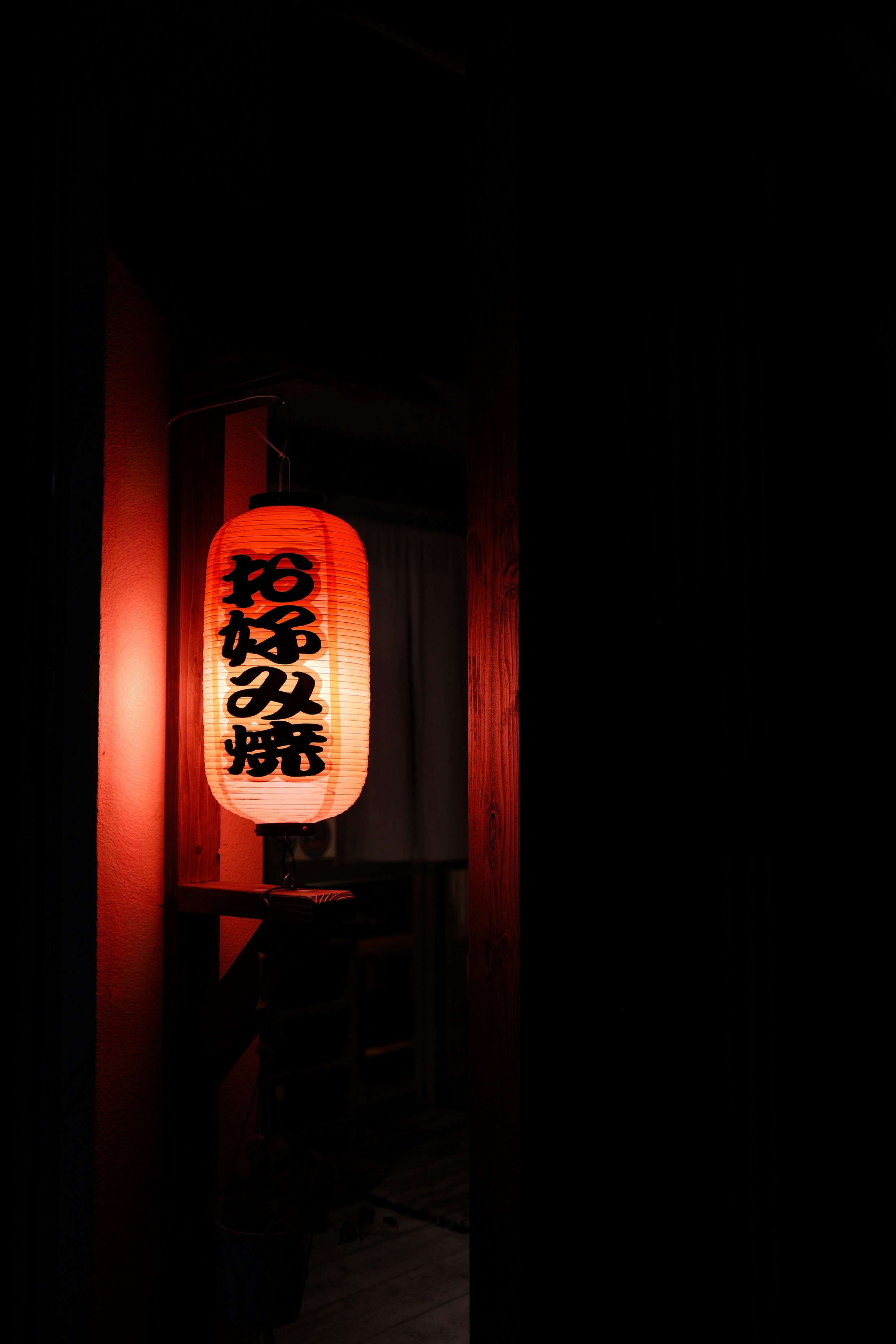 Red Lantern Glow in a Quiet Balcony