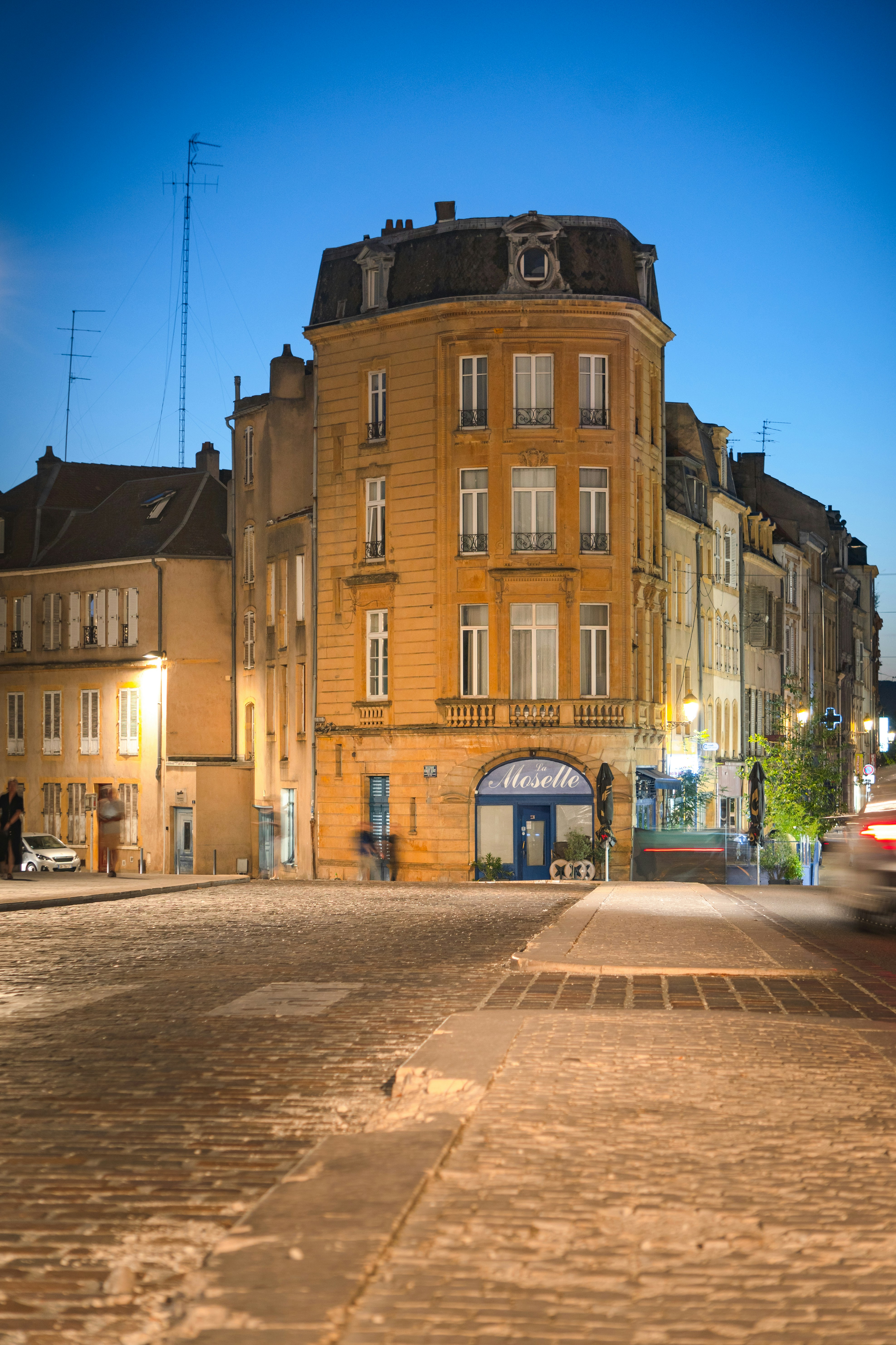 Moonlit Streetfront: The Corner Hotel in Warm Amber