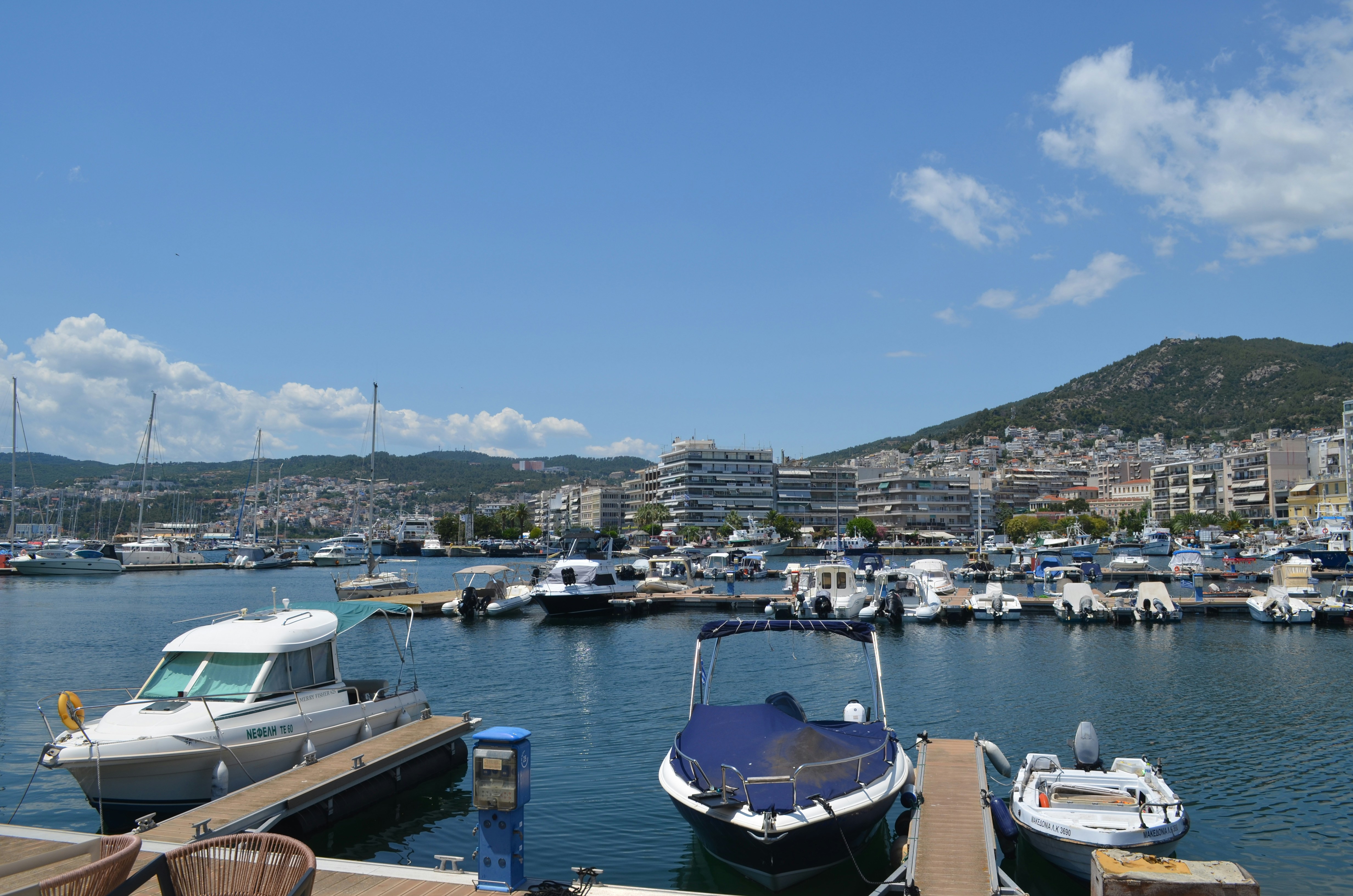 Harbor Portrait: Boats Docked Amid a Sunlit Coastal Town