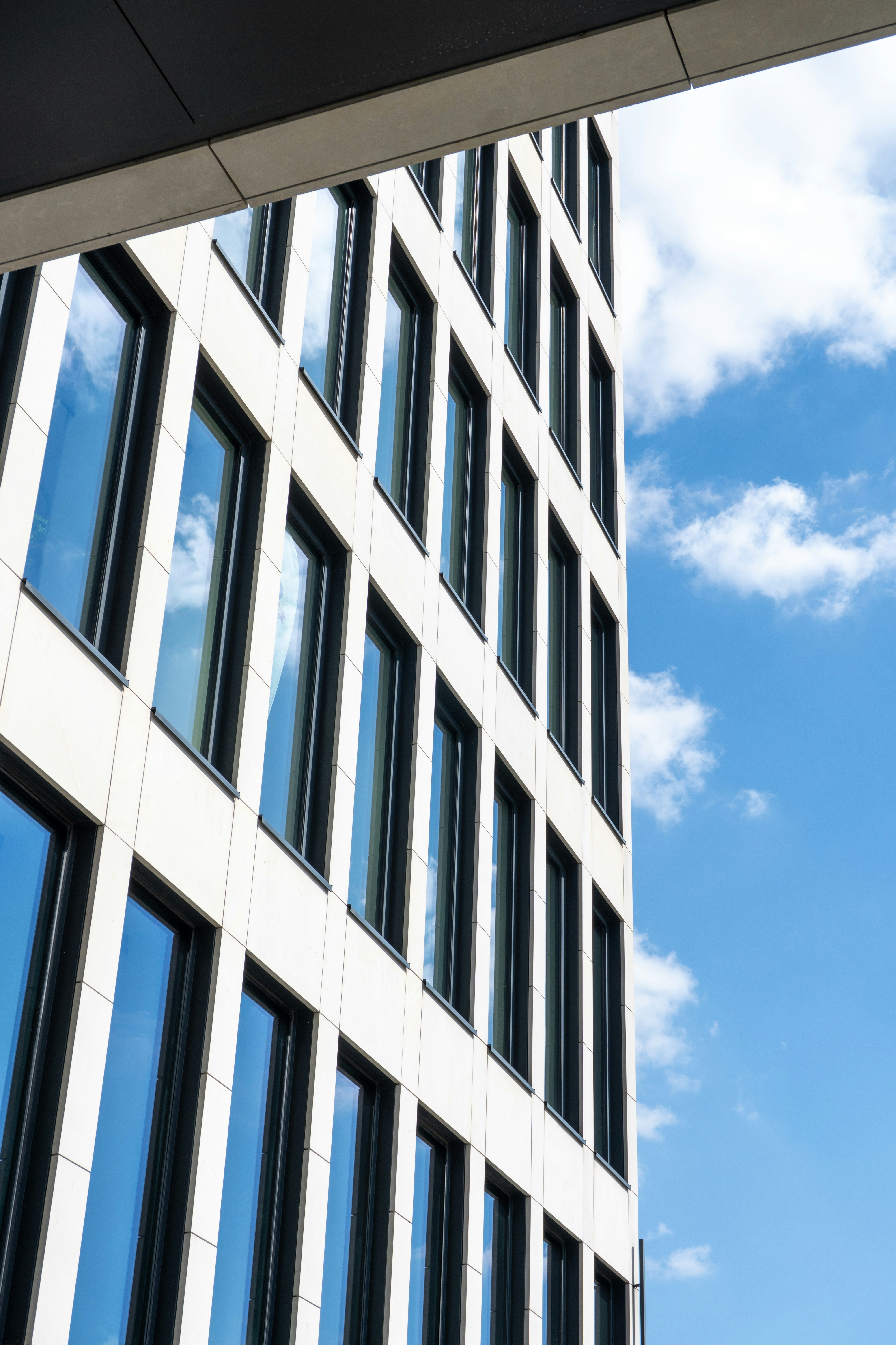 Skyward Facade: Light, Glass, and Gridlines