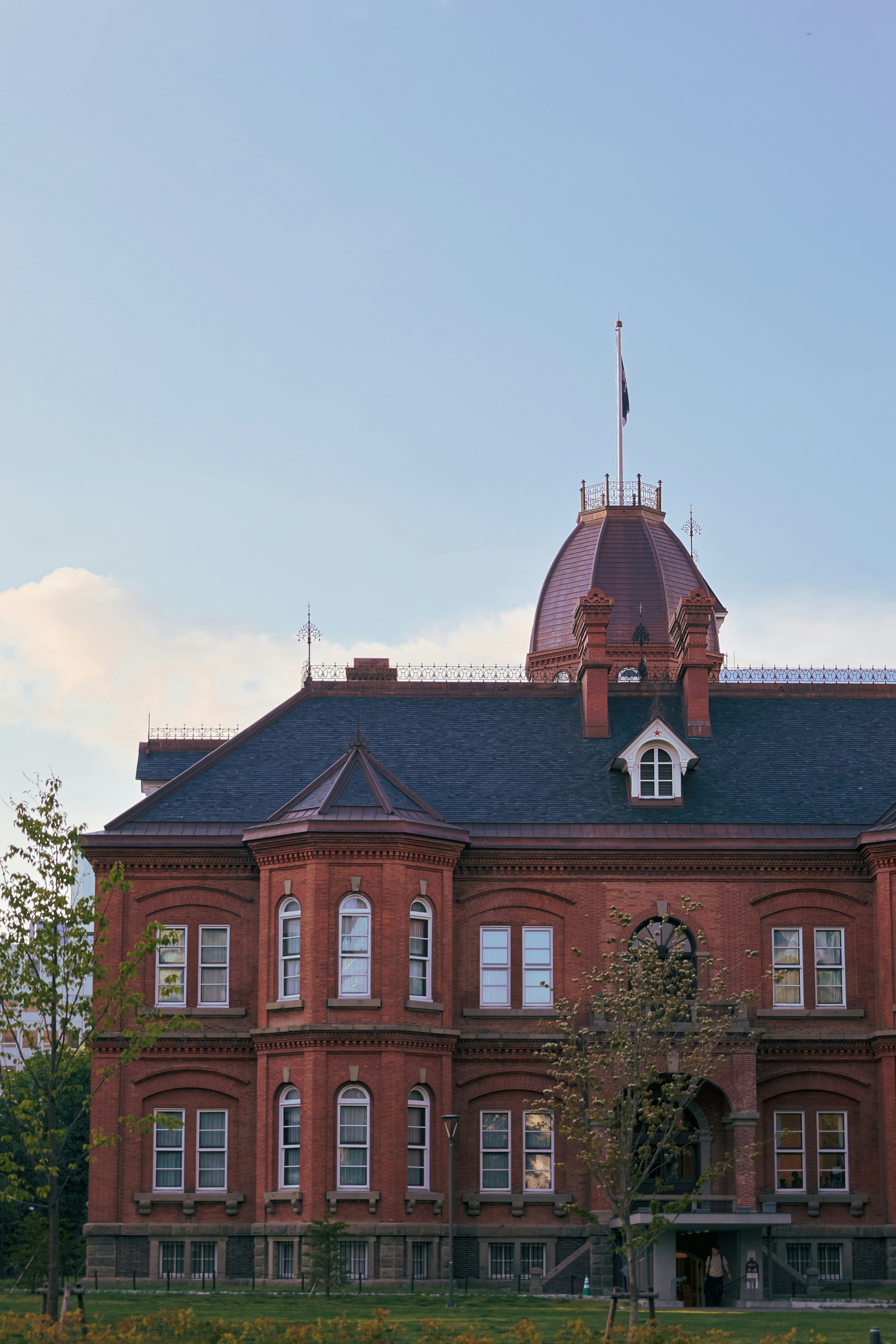 Brick Clerked Facade Under a Clear Sky