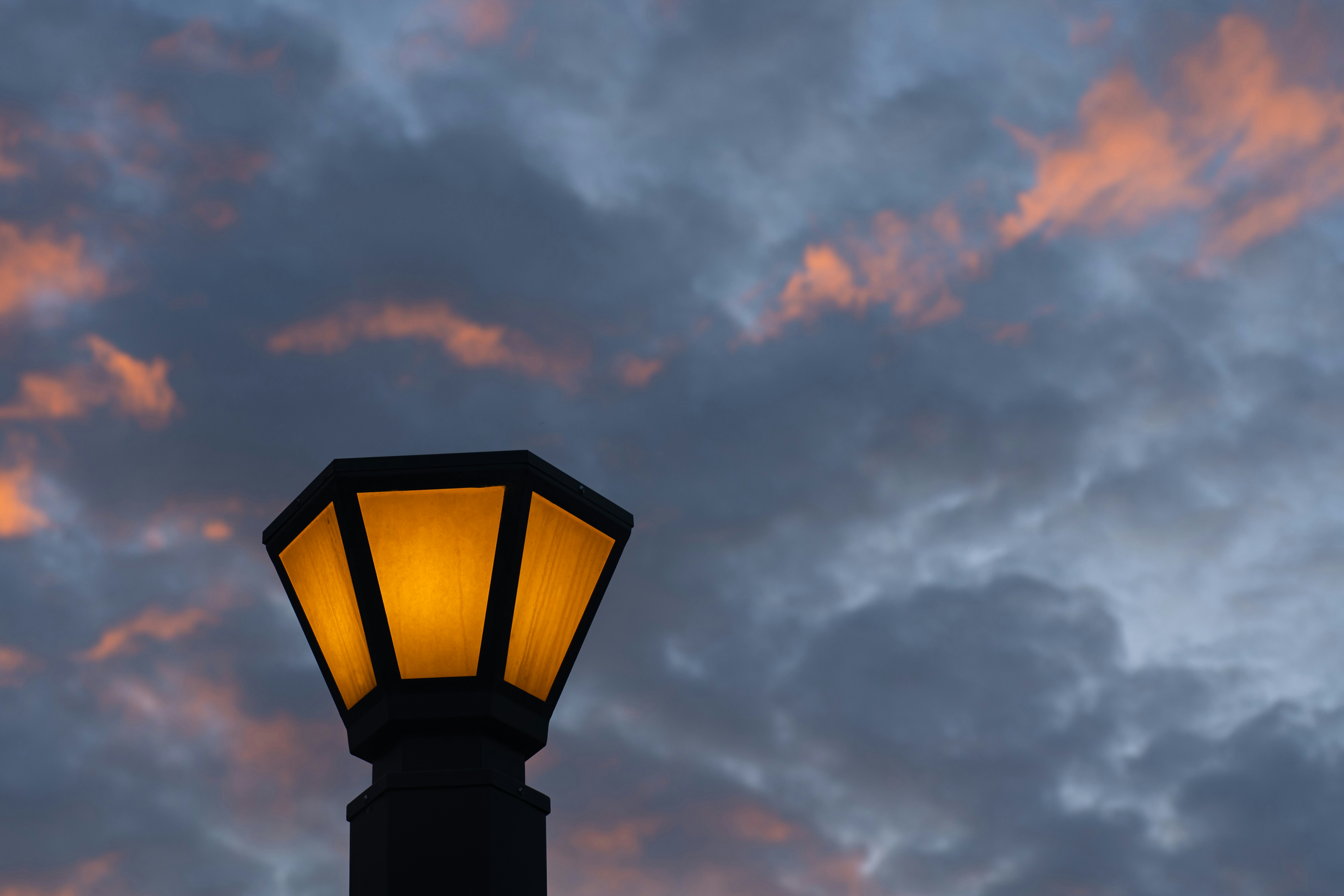 Glowing Lantern Against a Velvet Dusk Sky
