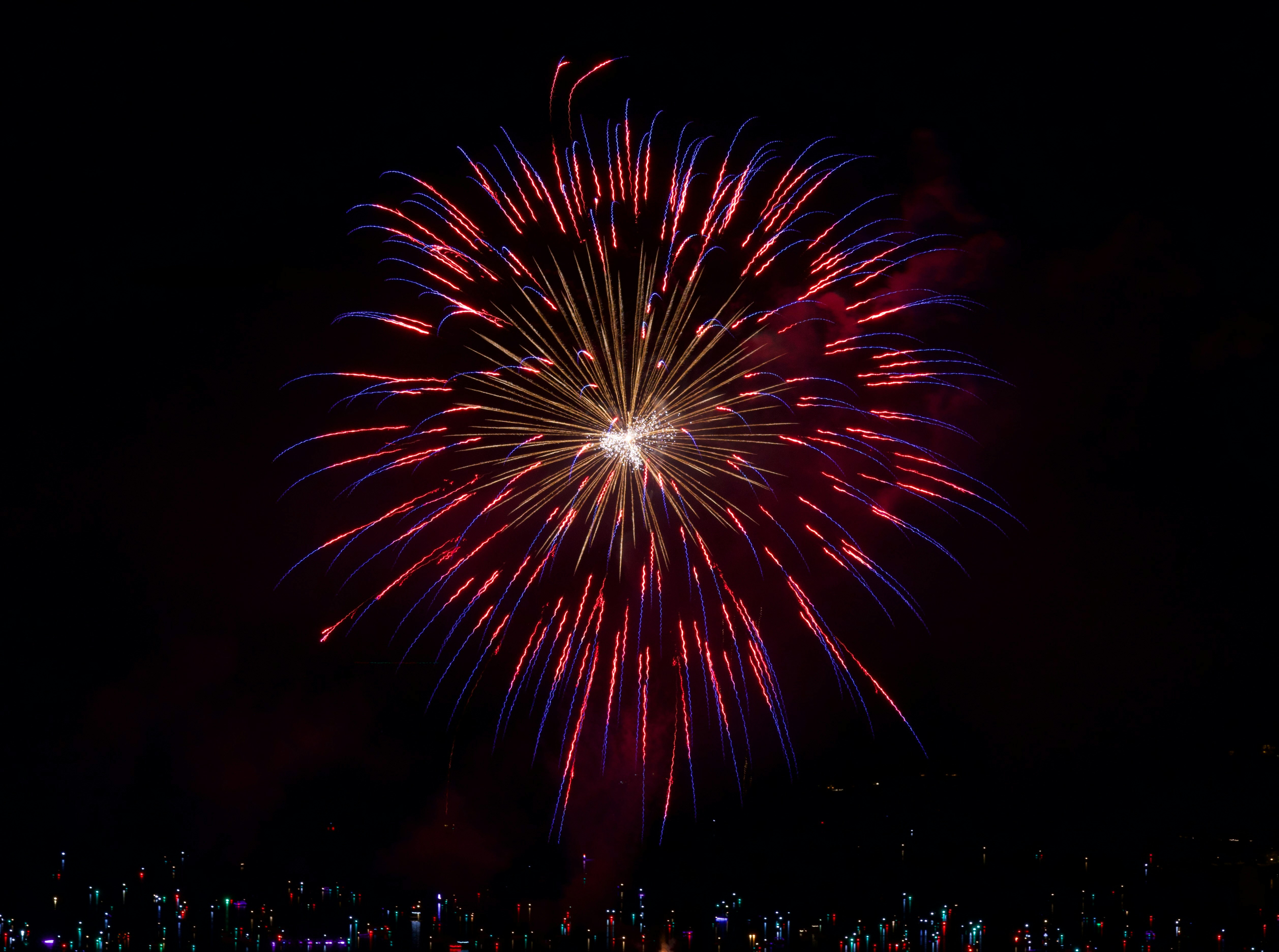 Midnight Burst: Fireworks Crown the City Skyline