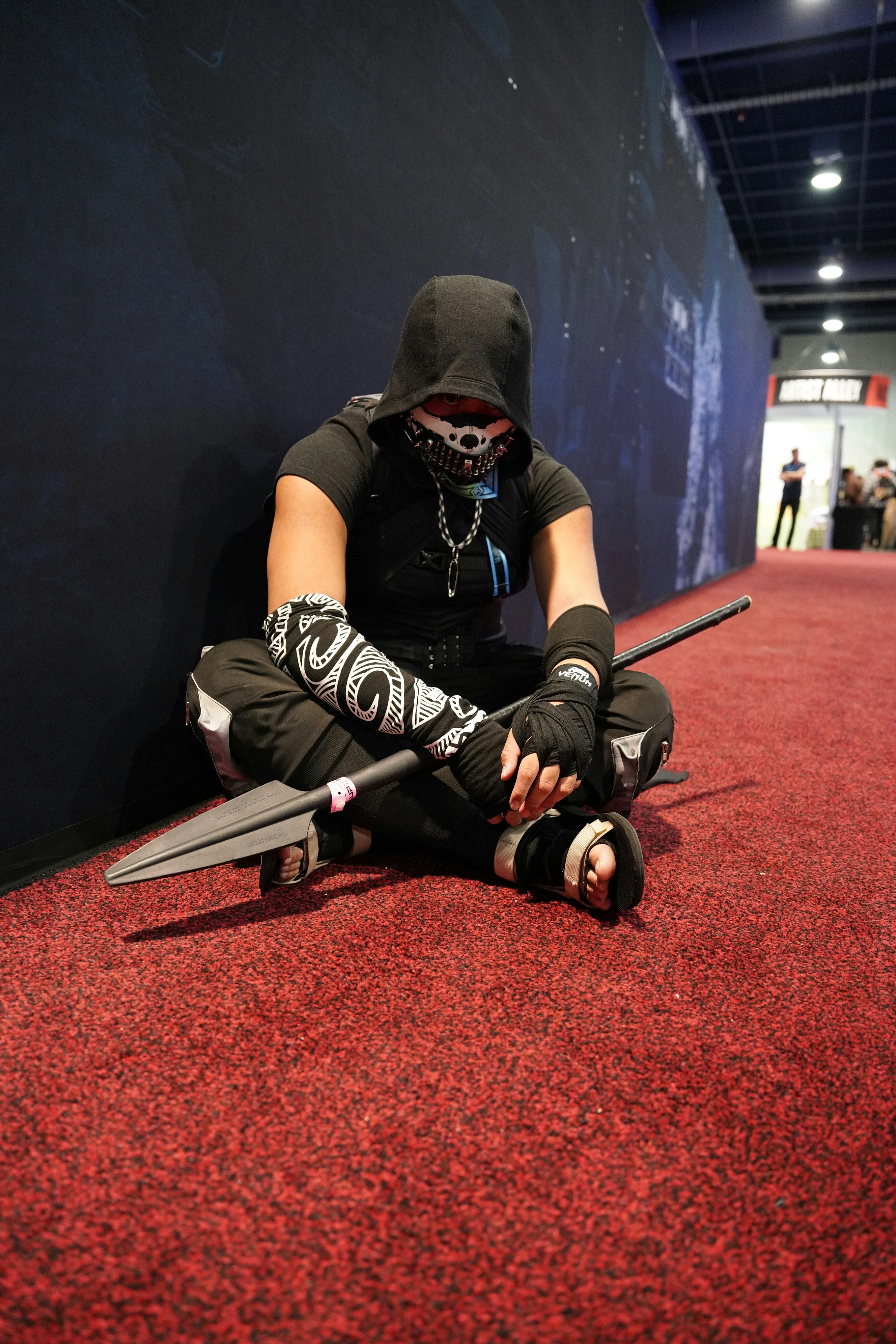 Masked Warrior in a Crimson Corridor