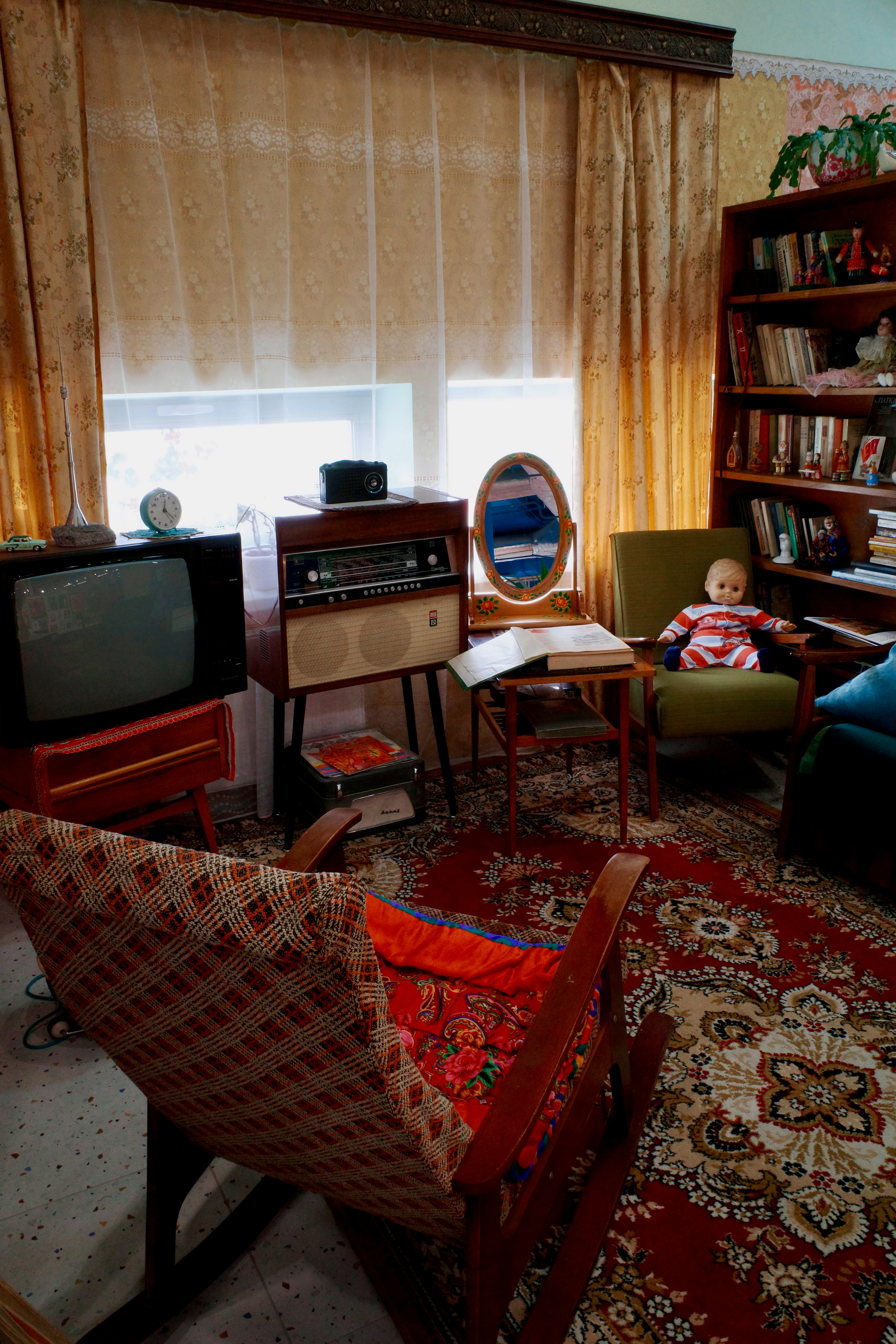 Retro Living Room Corner with Vintage Electronics and Plush Chair