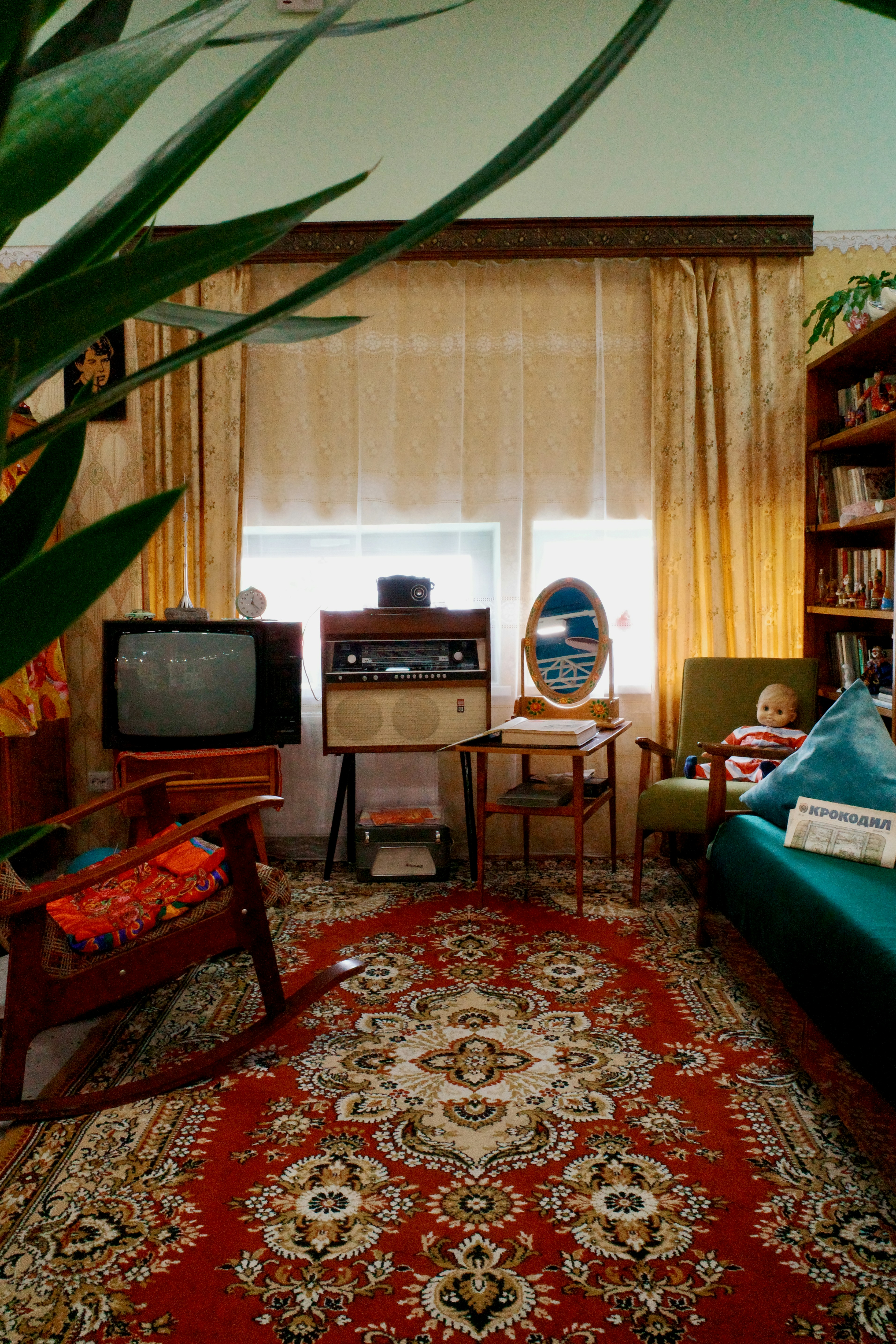 Nostalgic Living Room with Vintage Tech and Plush Seating
