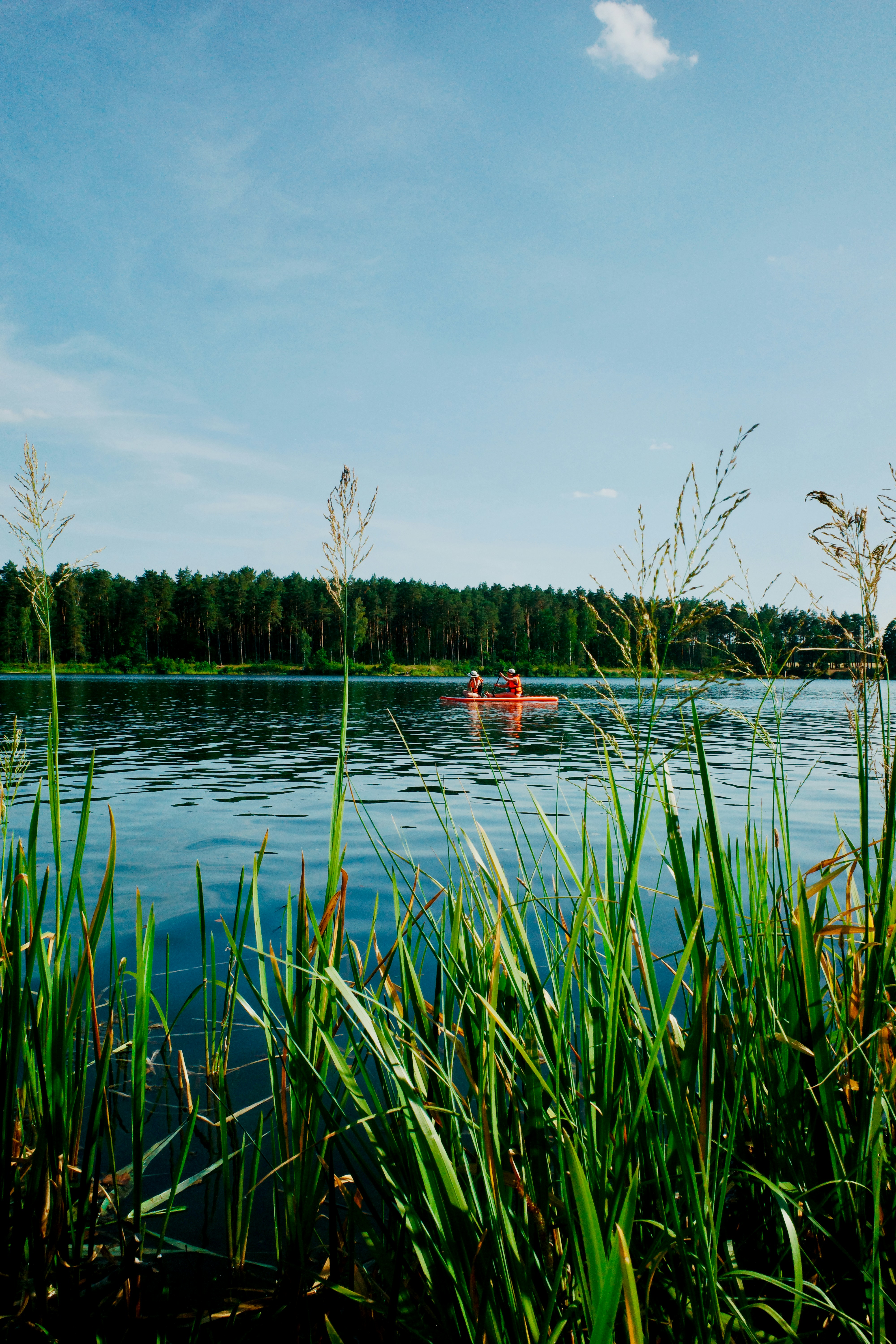 Red Distant Kayaks on a Quiet Lake