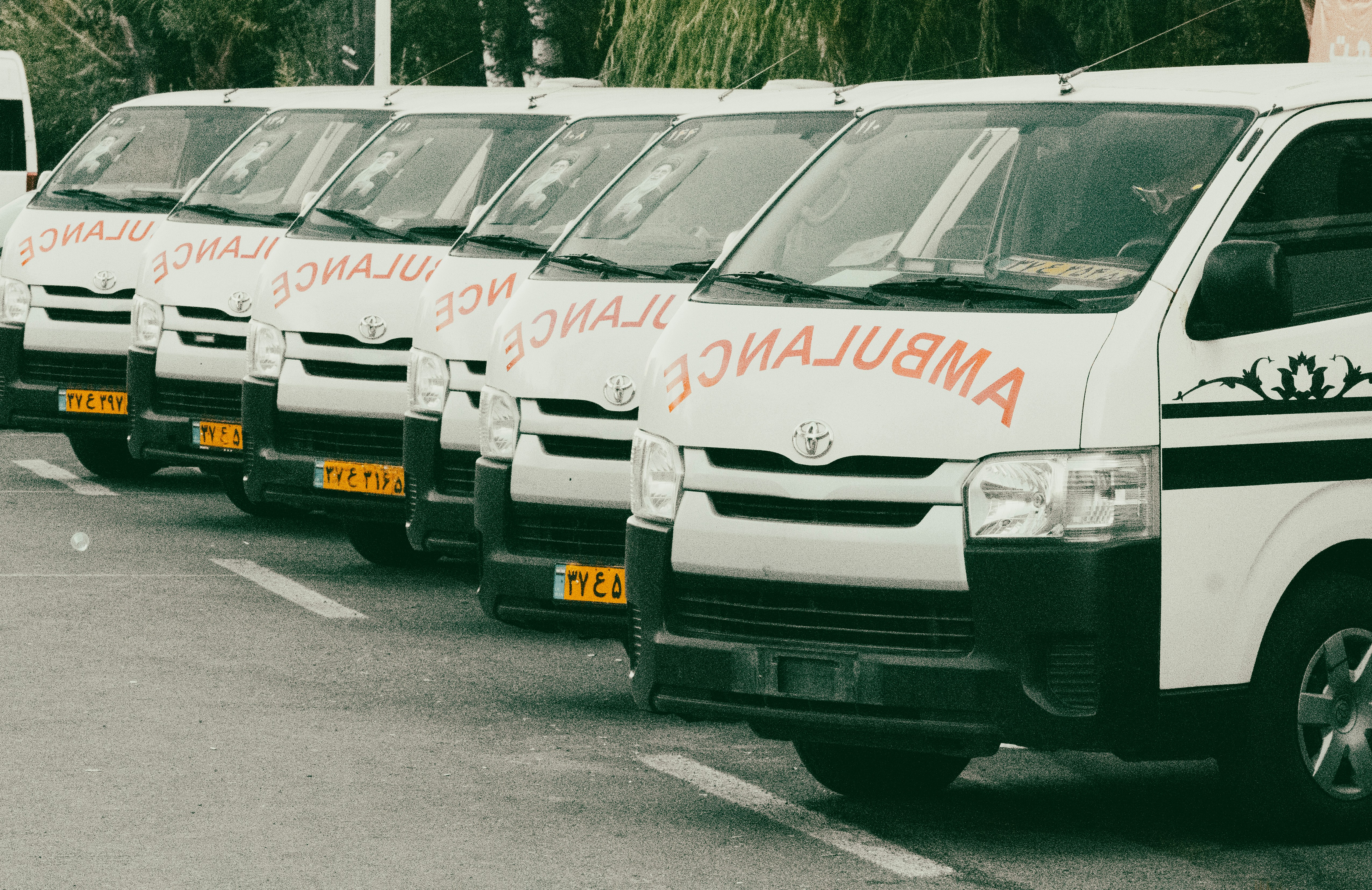 Line of Waiting Ambulances: A Row of White Rescue Vans