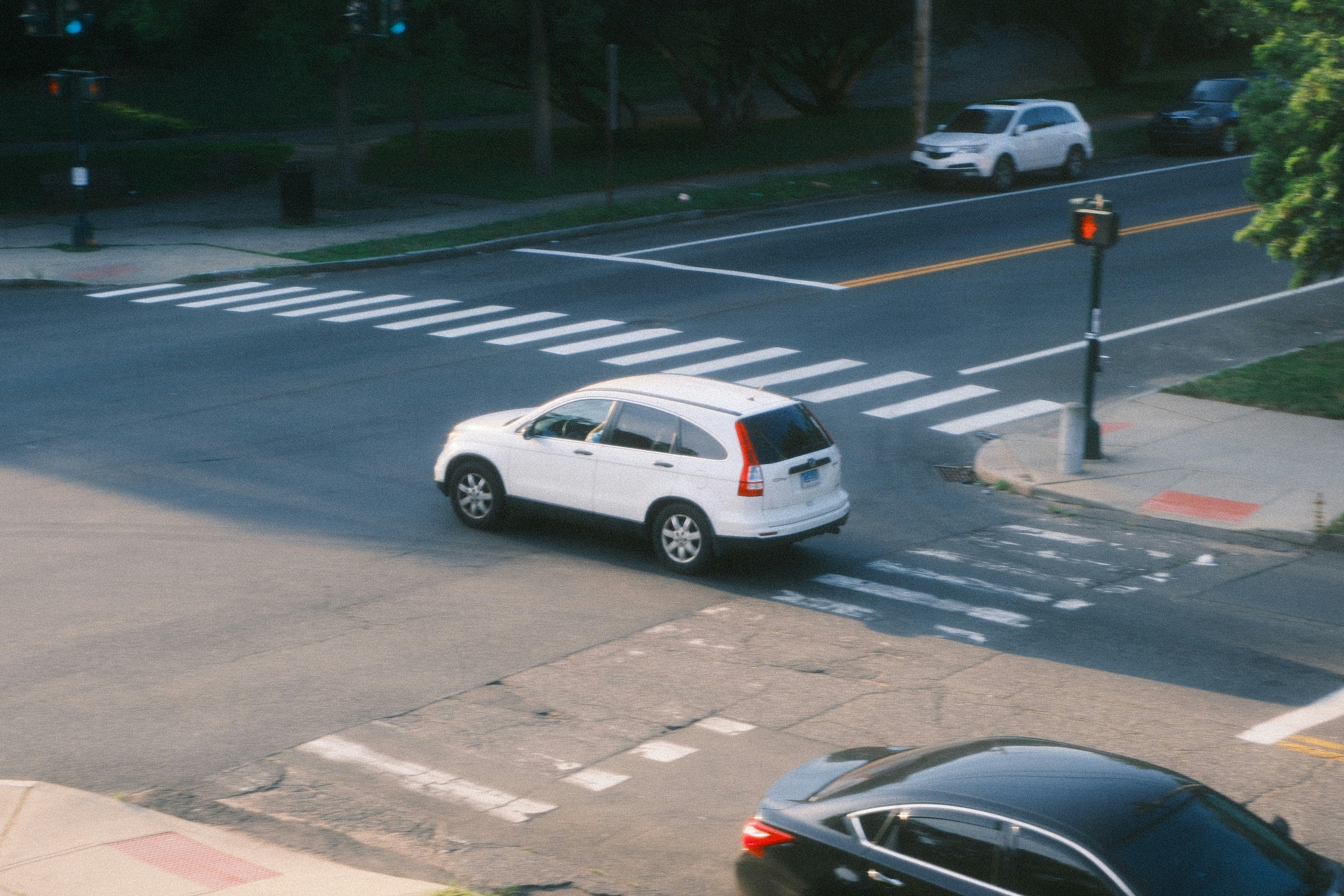 Crosswalk Crossing: A Quiet City Moment at Dawn