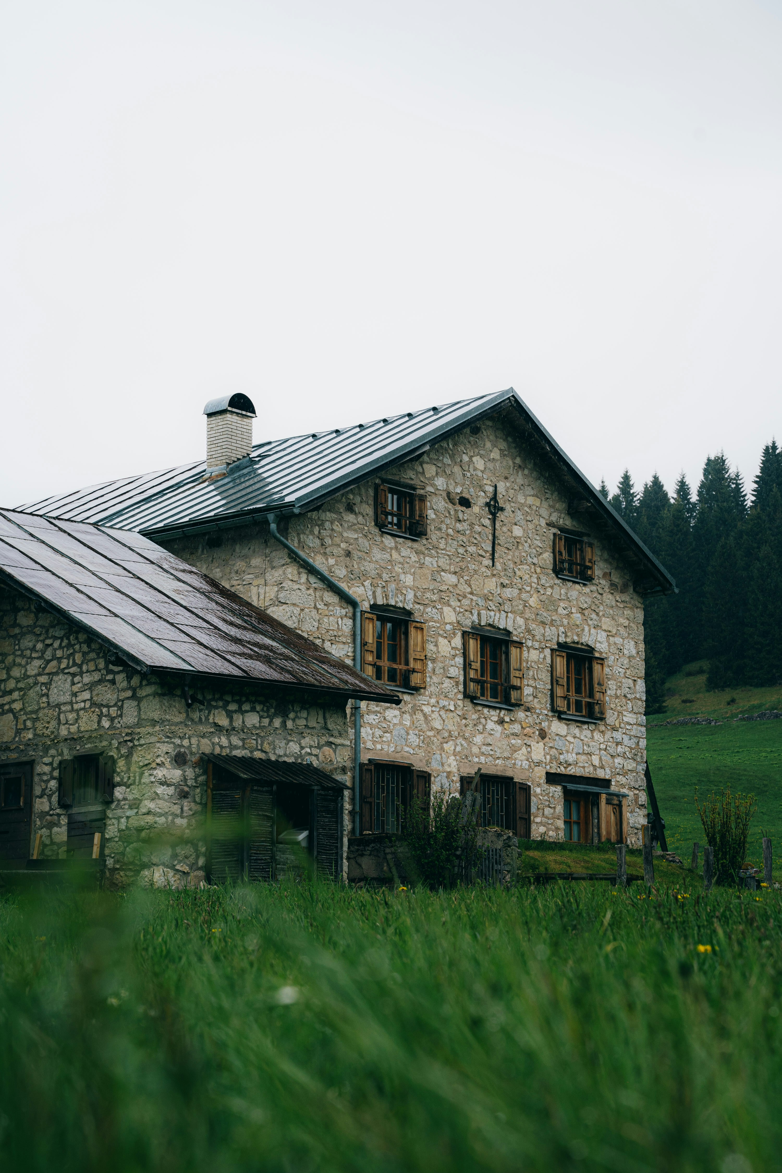 Stone Farmhouse Against a Mountain Backdrop