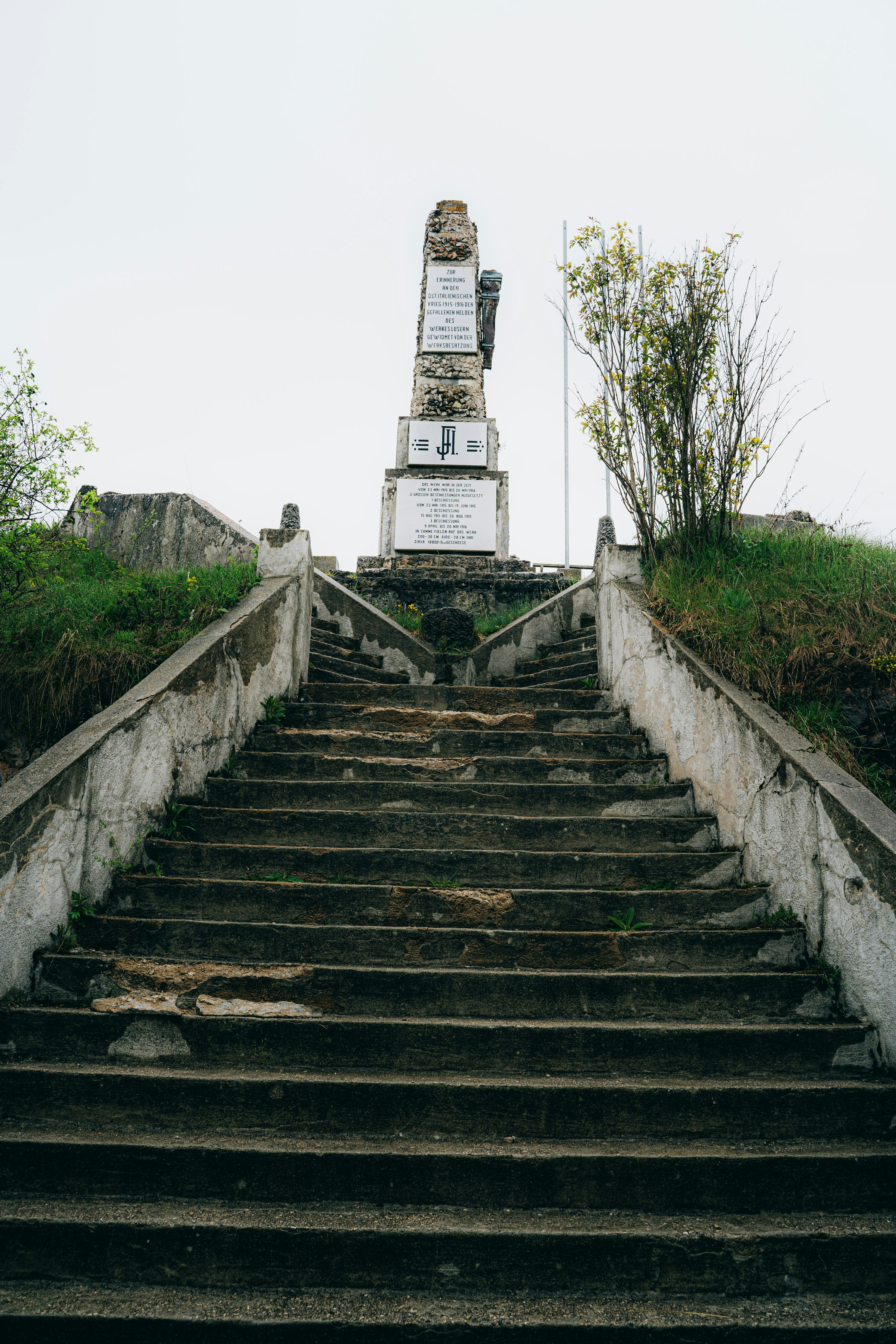 A Weathered Ascent: Steps to a Stone Monument on a Hill