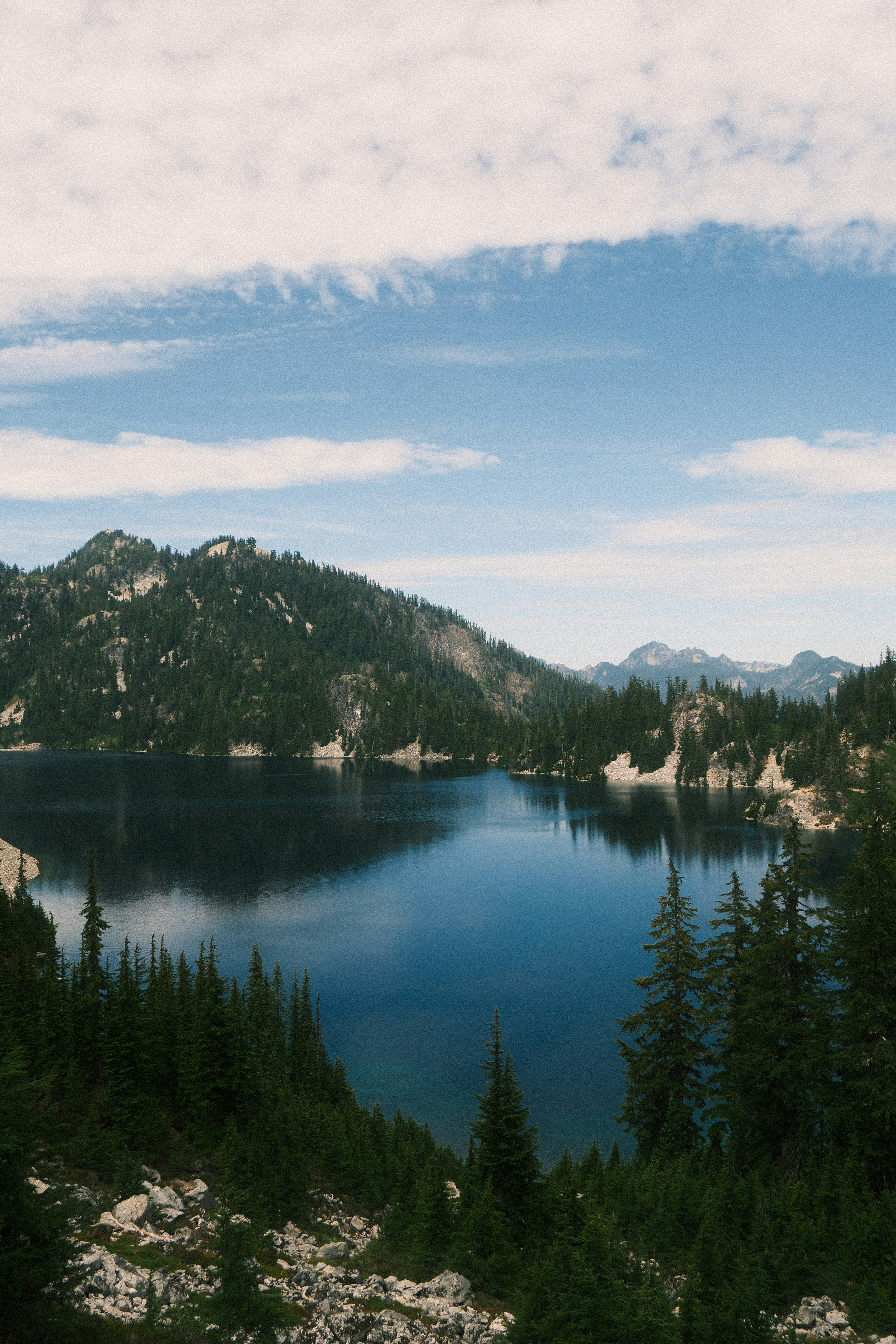 Emerald Crown: A Quiet Lake Surrounded by Pine and Sky