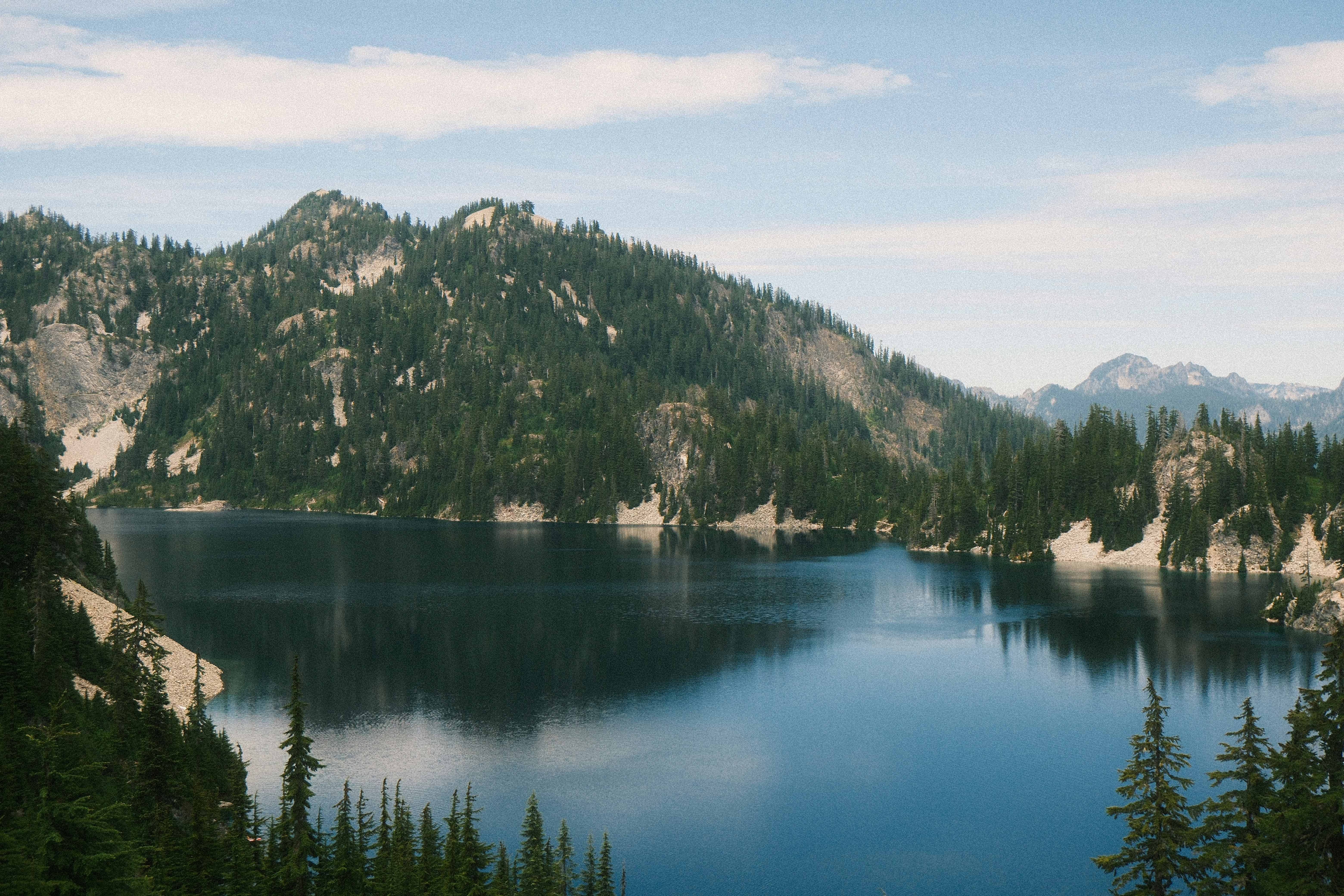 Mirror Lake Between Pine-dotted Cliffs