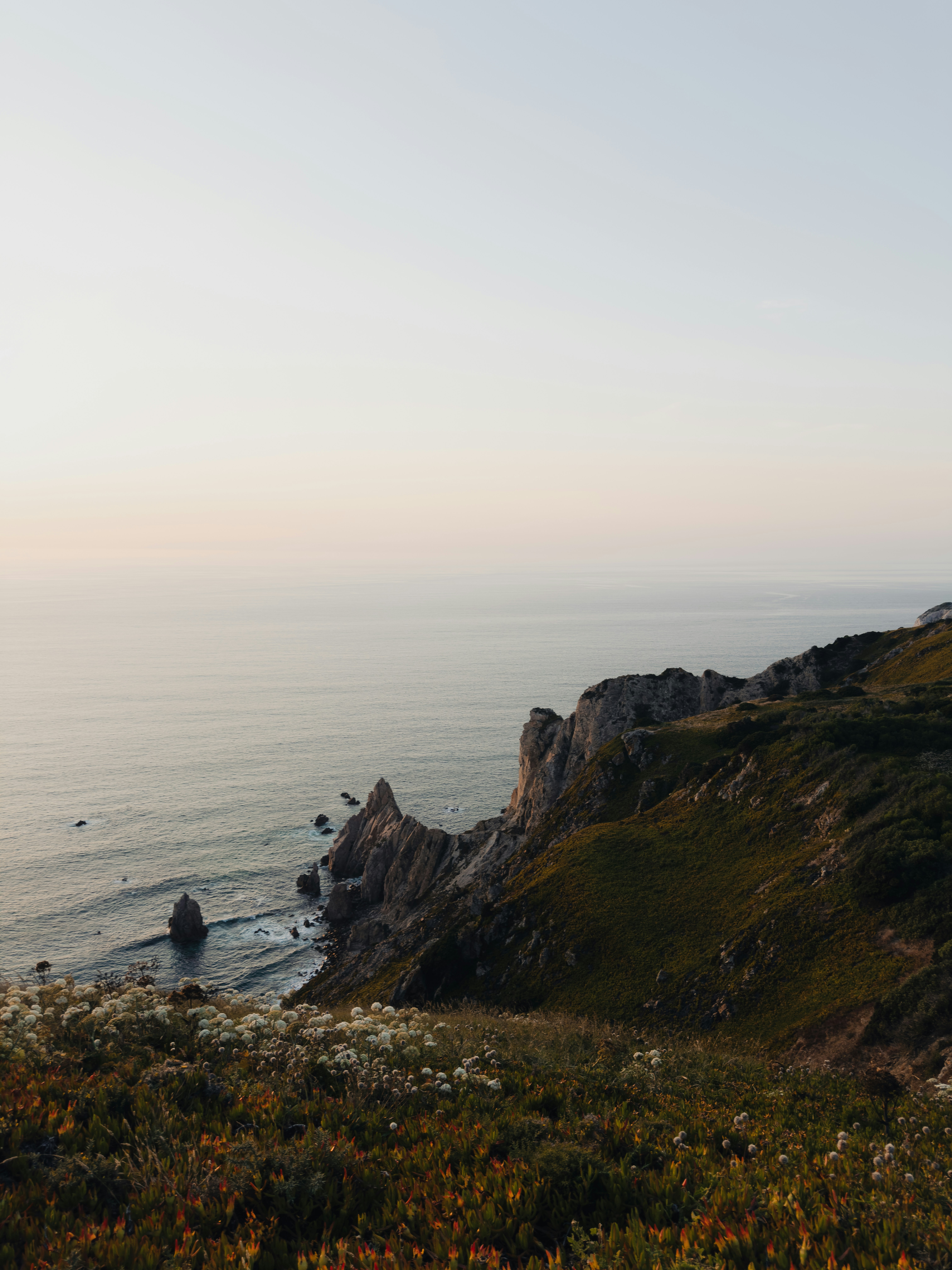 Cliffside Vista at Golden Hour Over the Calm Sea
