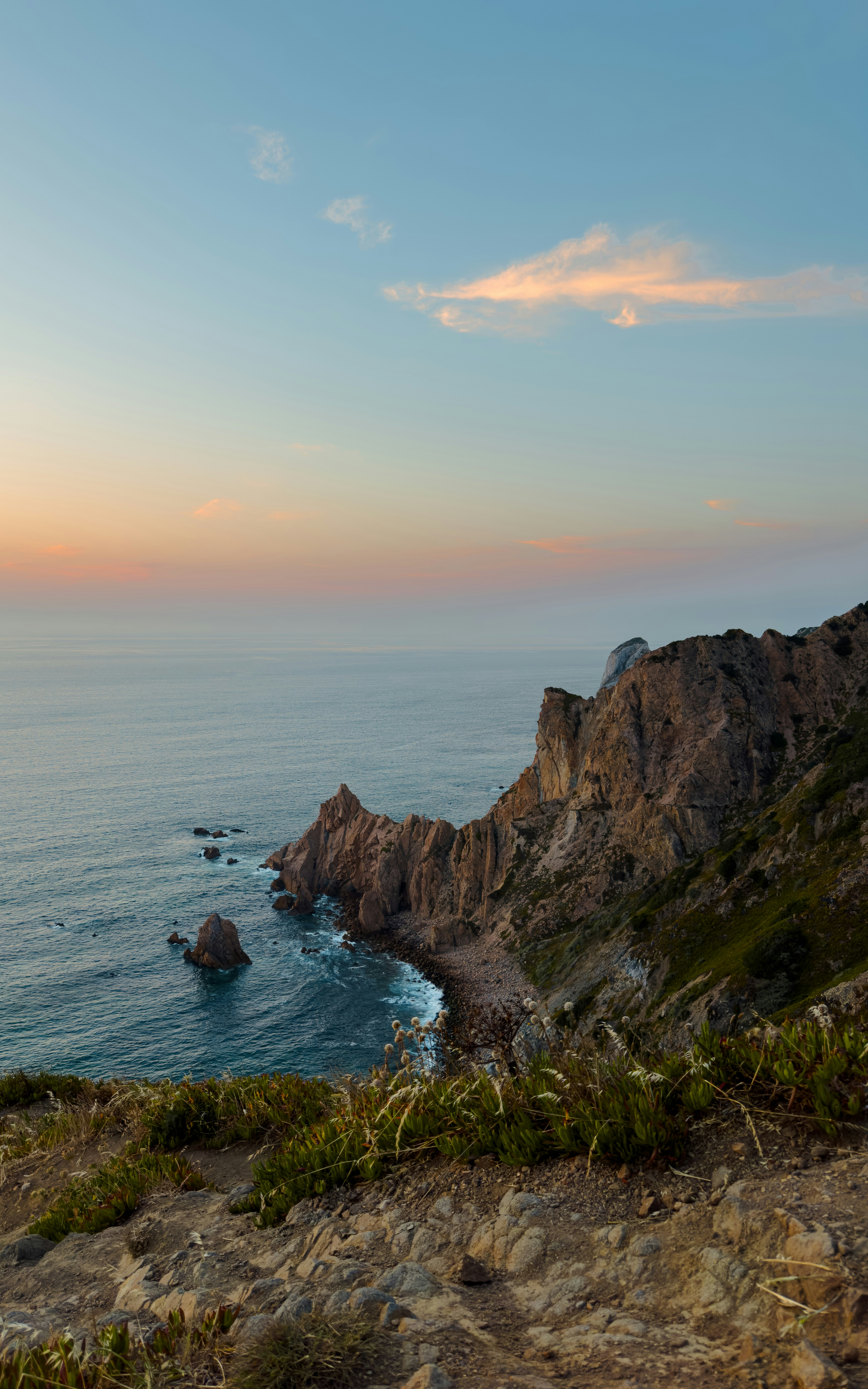 Cliff Edge Vista at Sunset Over the Quiet Sea