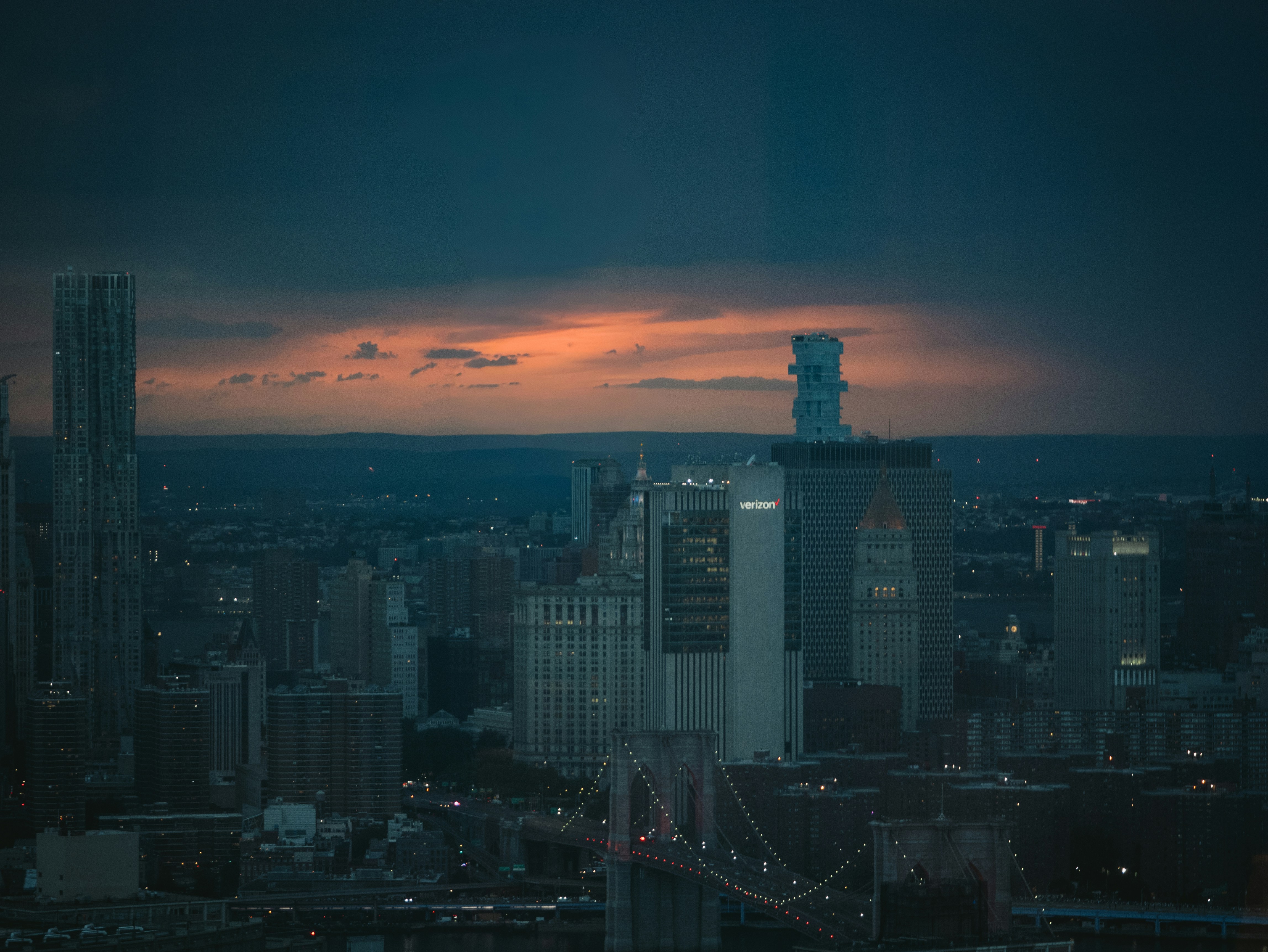 Sunset on the Ridge: Neon Arc over a Quiet Metropolis
