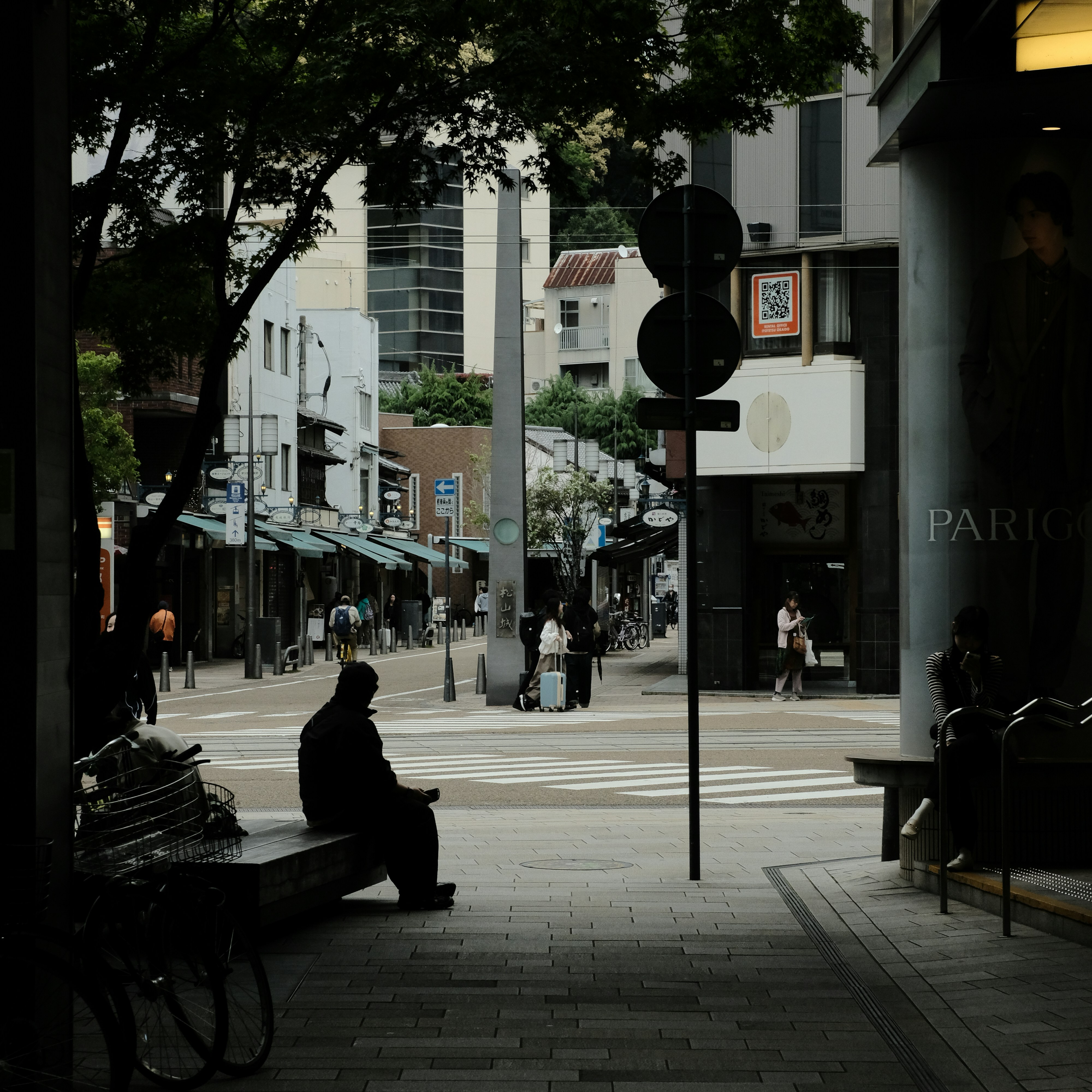 Shadows on the Sidewalk: Quiet Street Across a City Crossing