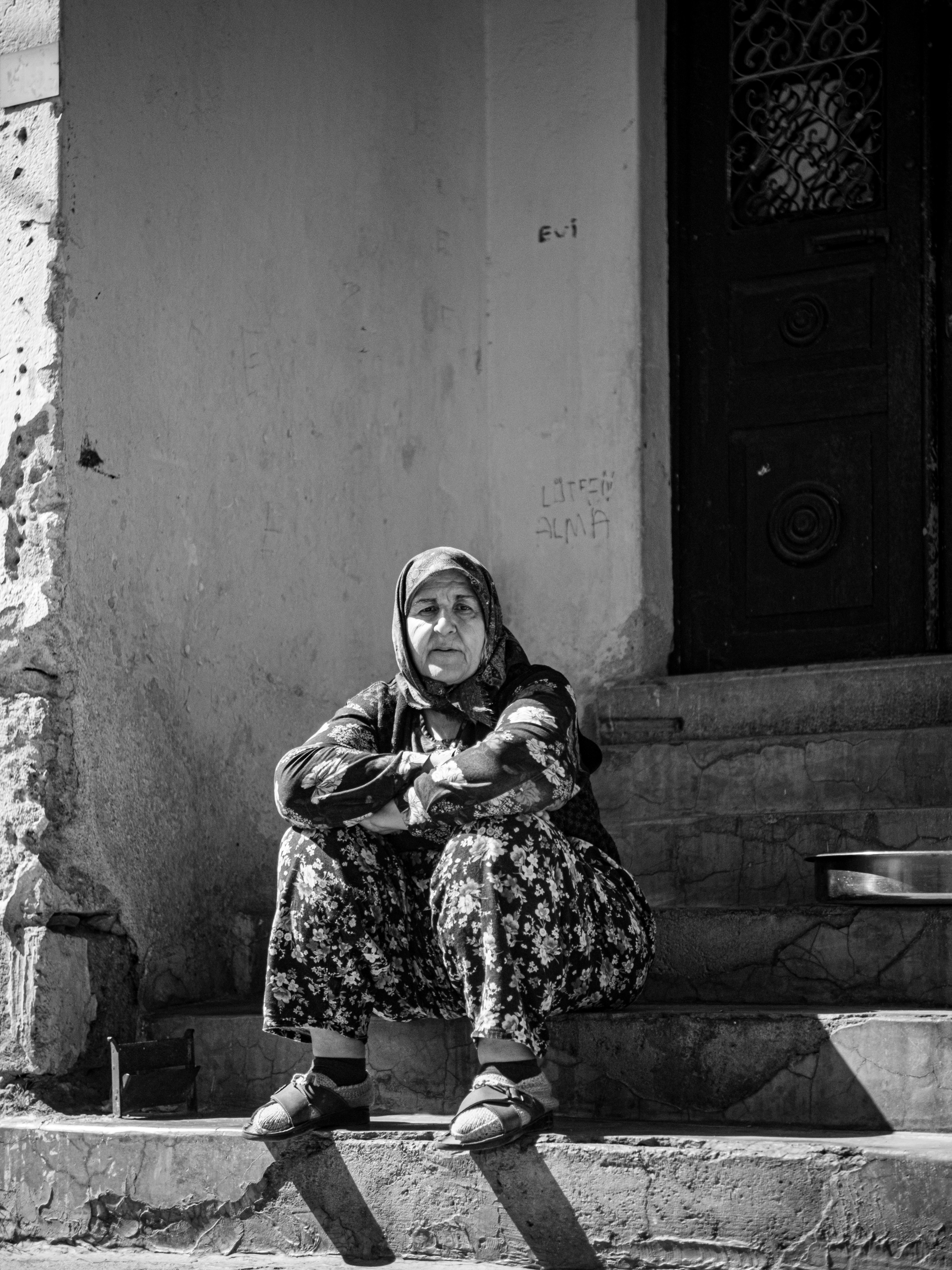 Sitting on the Threshold: A Quiet Portrait of Endurance