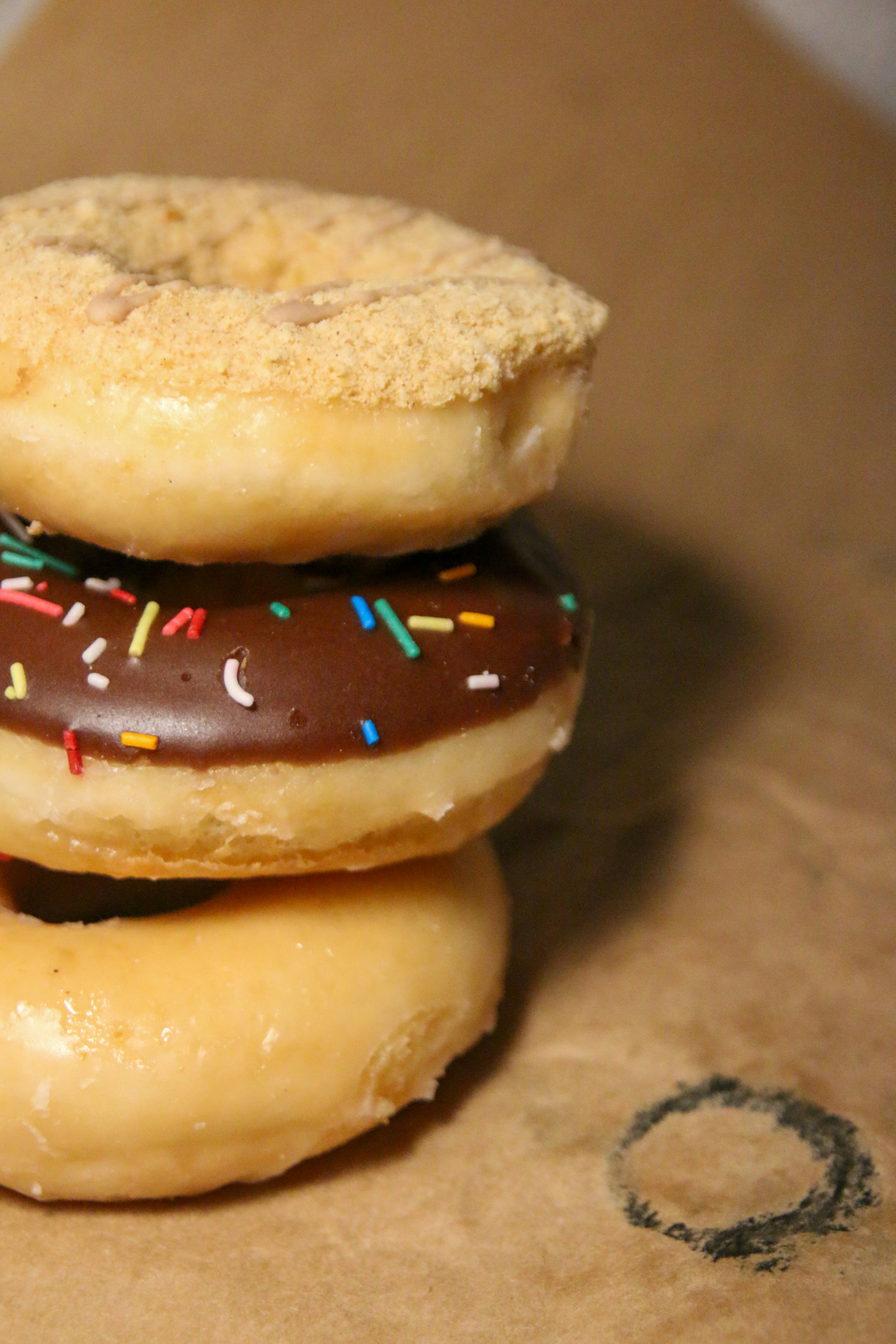 Sugar-Coated Stack: A Quiet Moment with a Chocolate Donut