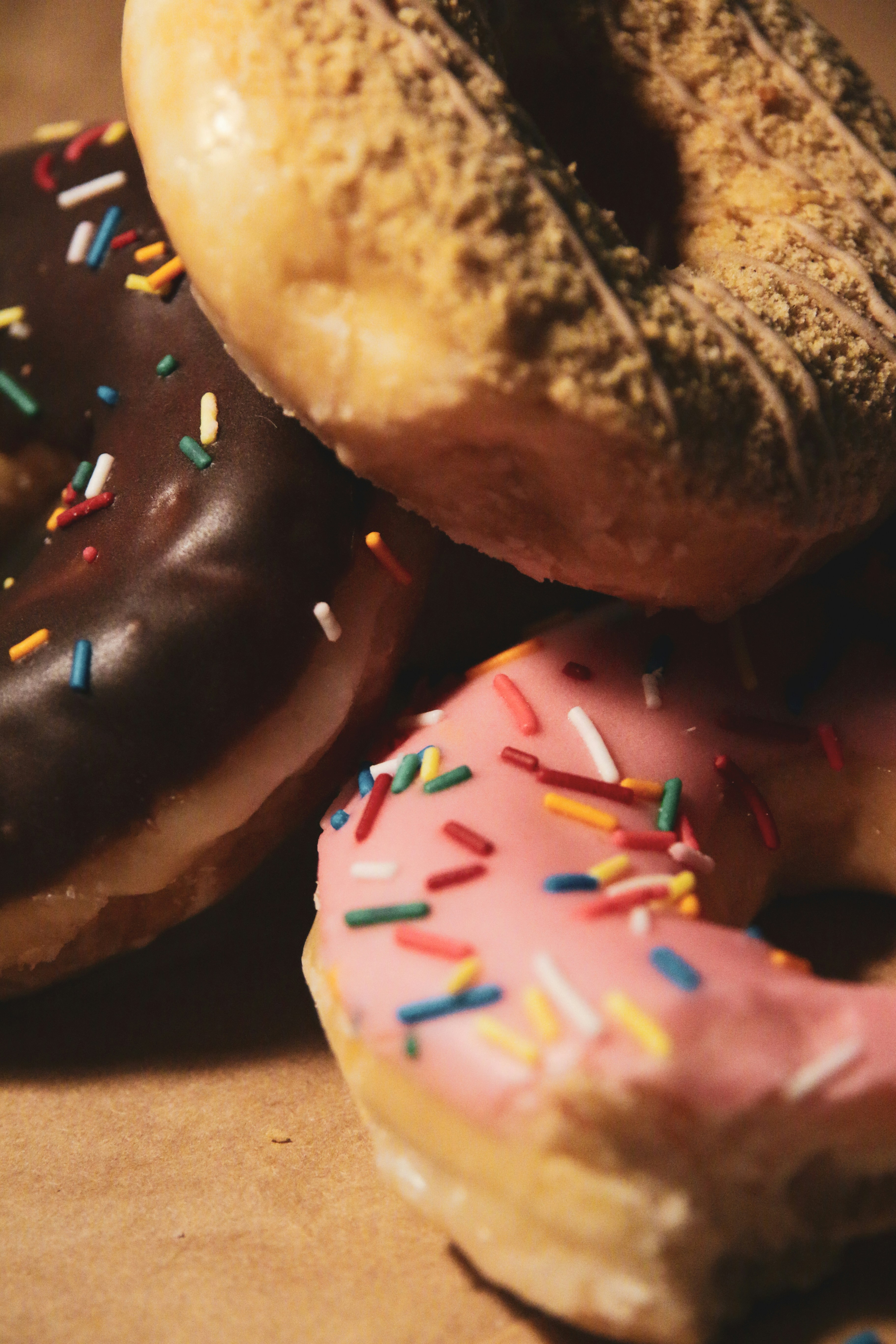 Donuts in Focus: A Close-Up of Powdered Delights with Sprinkles