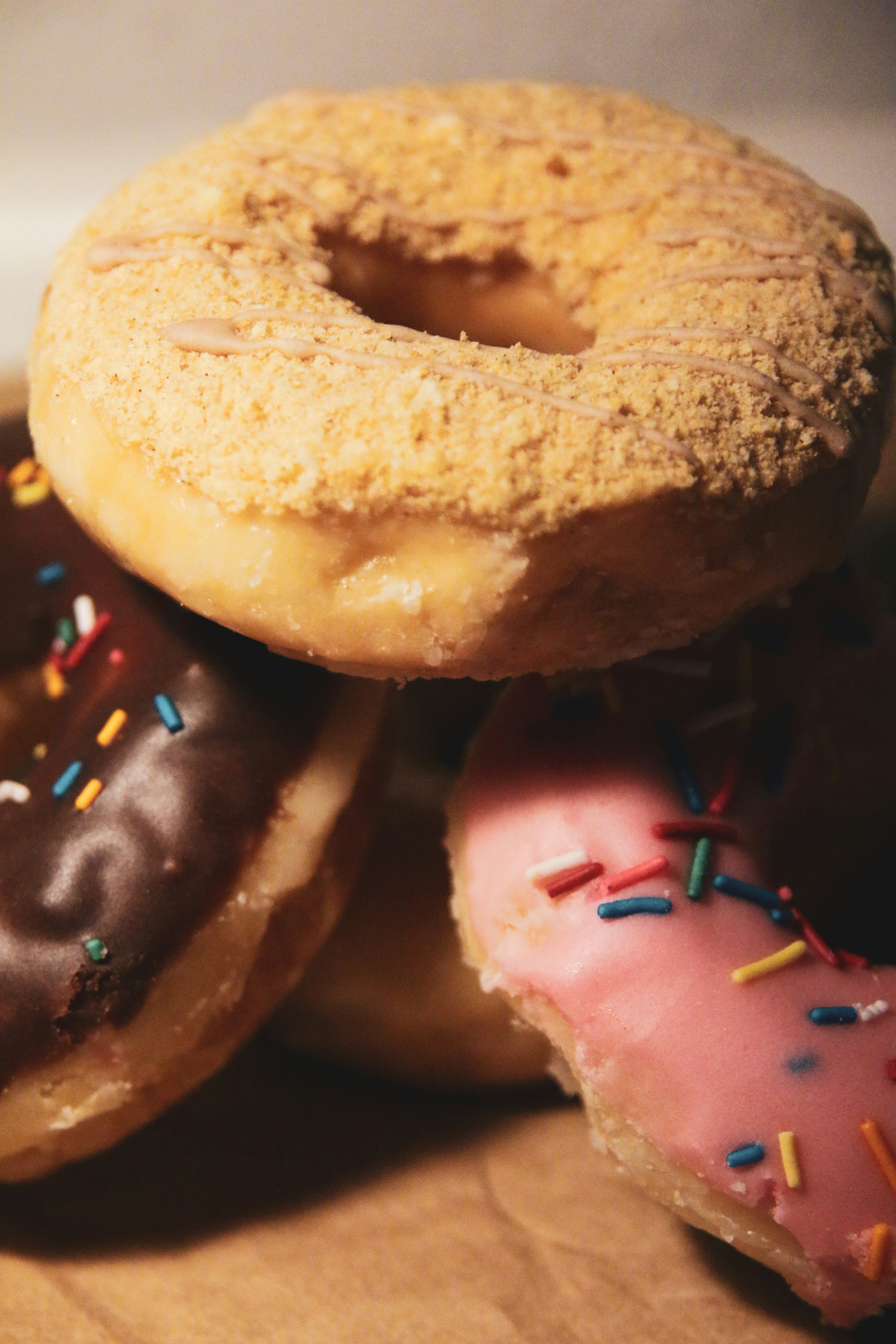 Crumbed Spotlight: A Trio of Glazed Donuts with Sprinkles