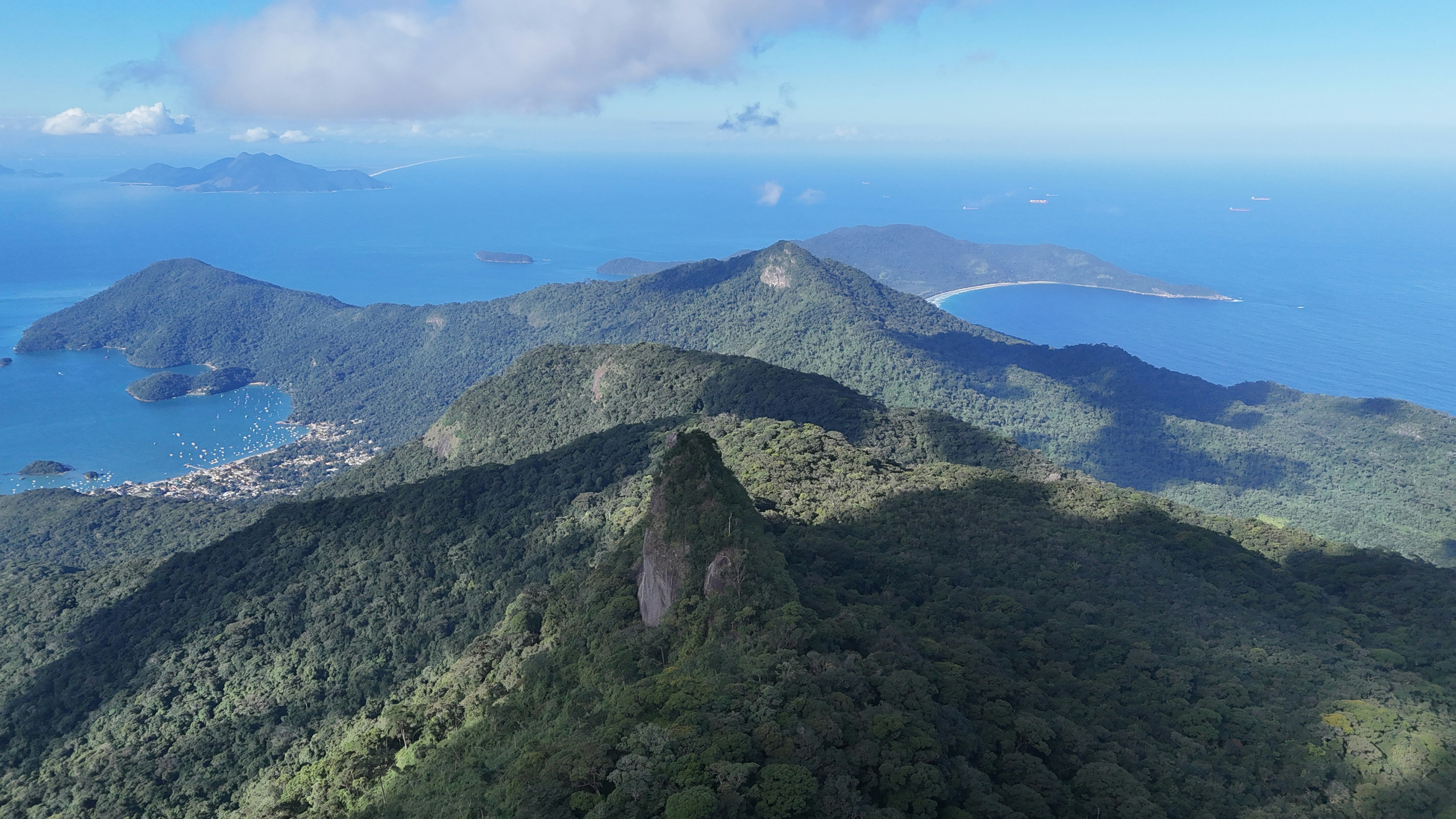 Green Ridges Meet the Sea: Aerial Vista of Island Chains
