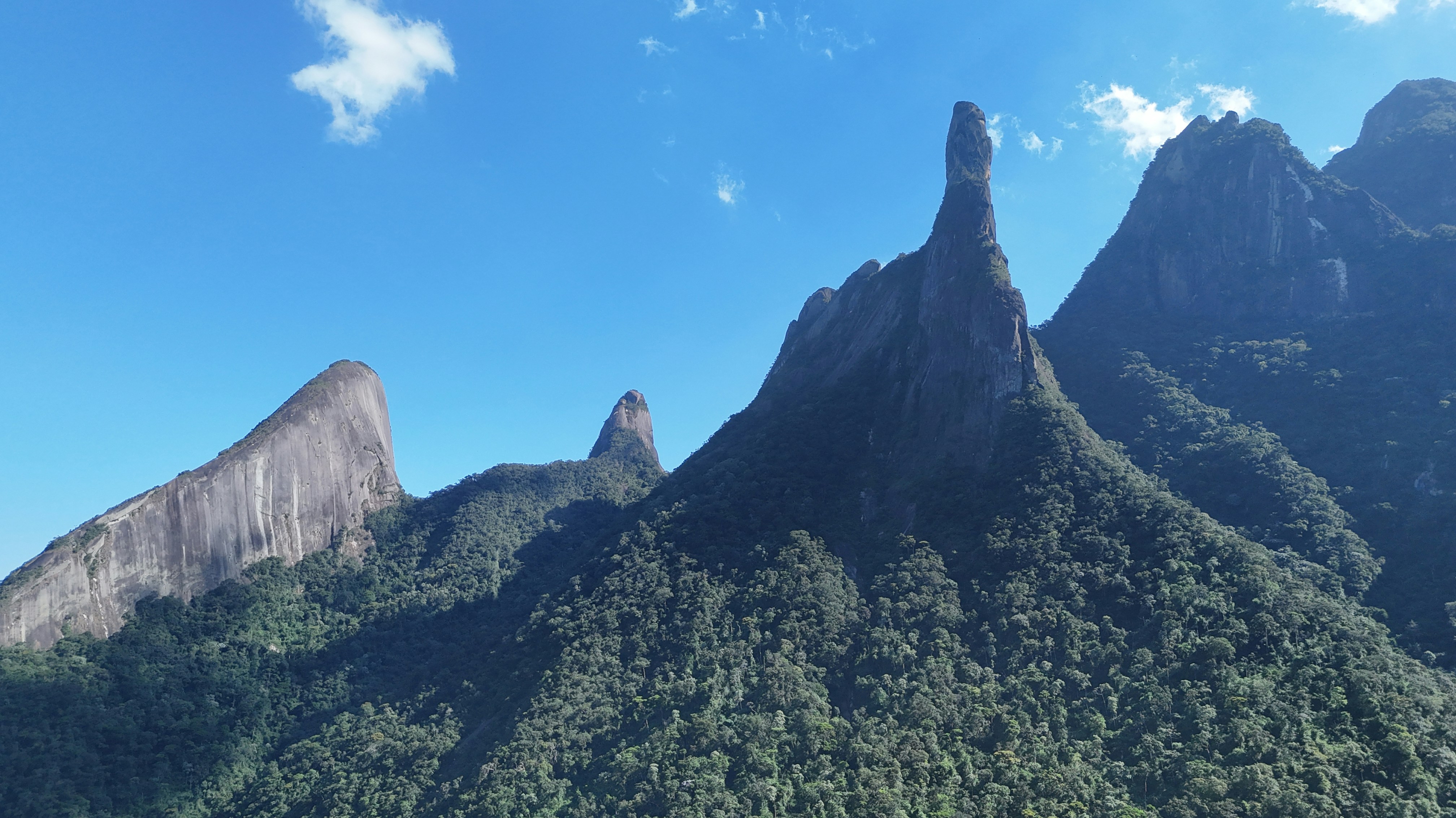 Jagged Peaks Rising Over Lush Valleys