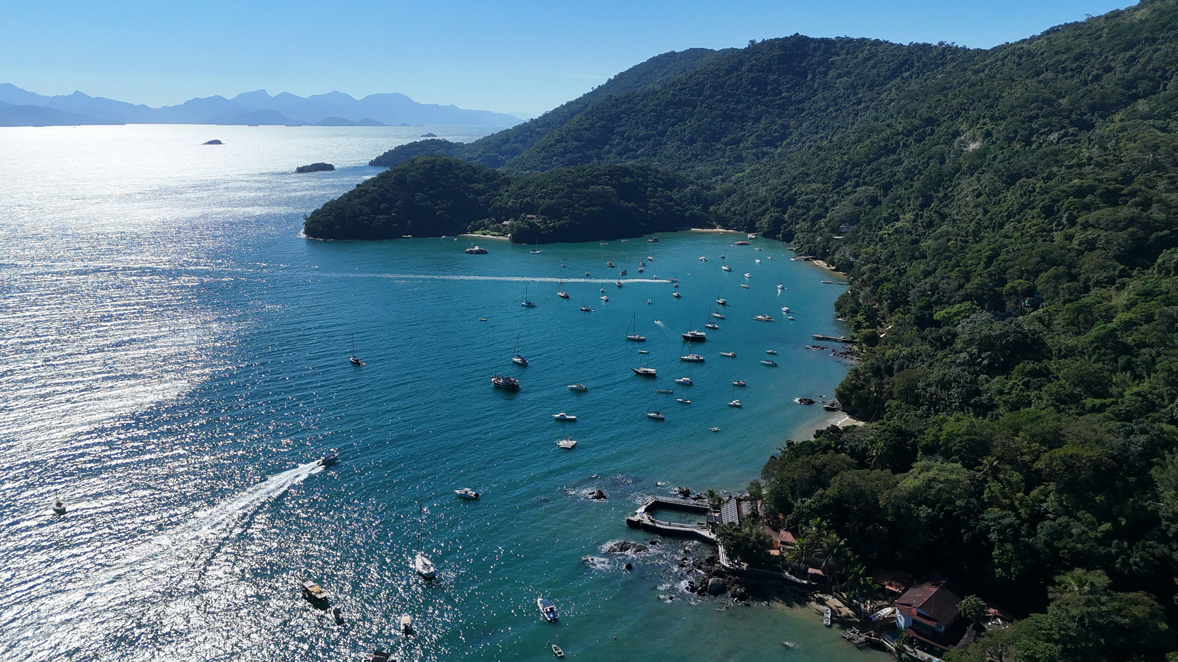 Harbor of Lantern Seafloor: Boats at Rest Along a Emerald Cove