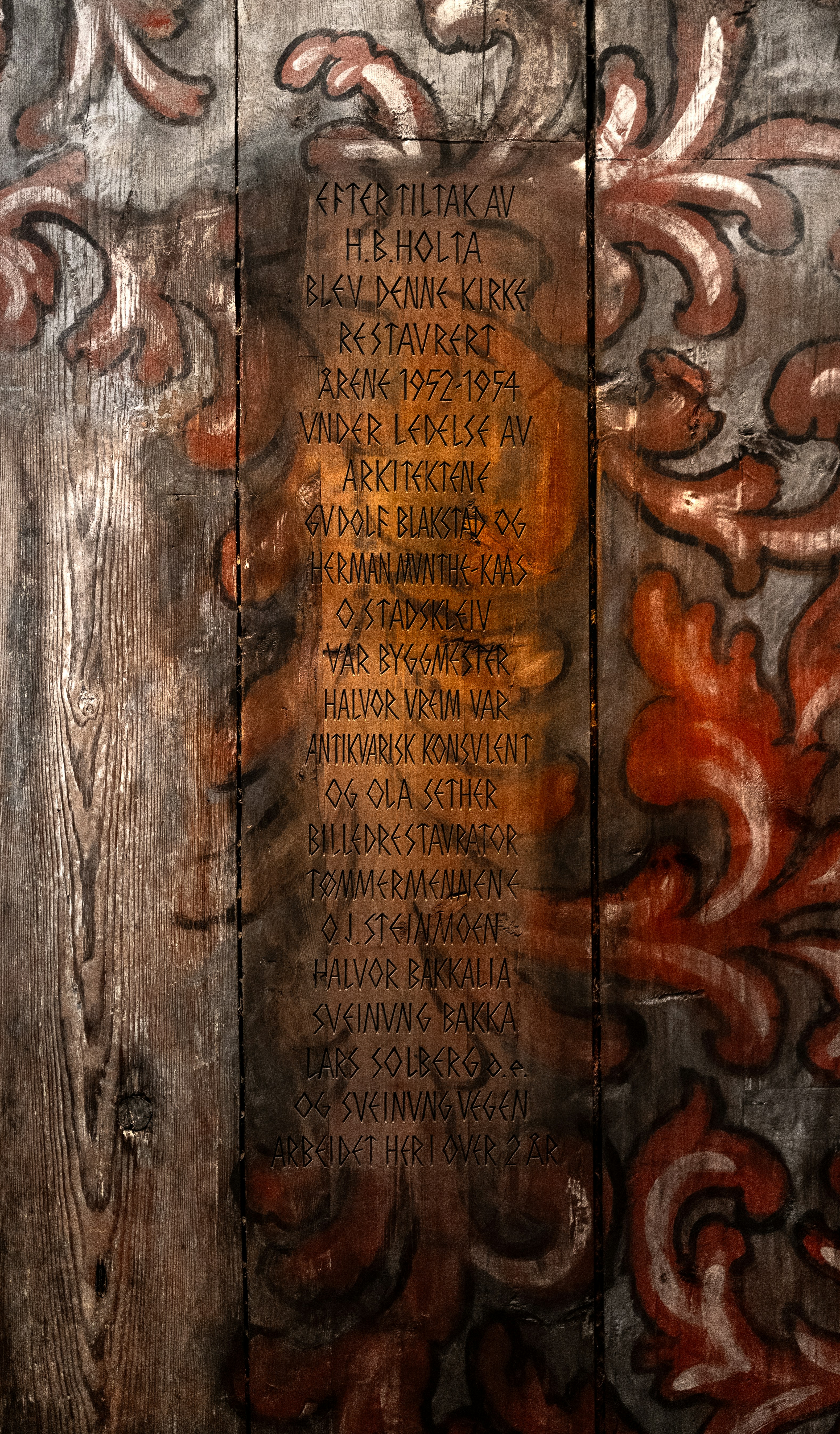 Inscribed Echoes: A Carved Slab of Time on Weathered Wood