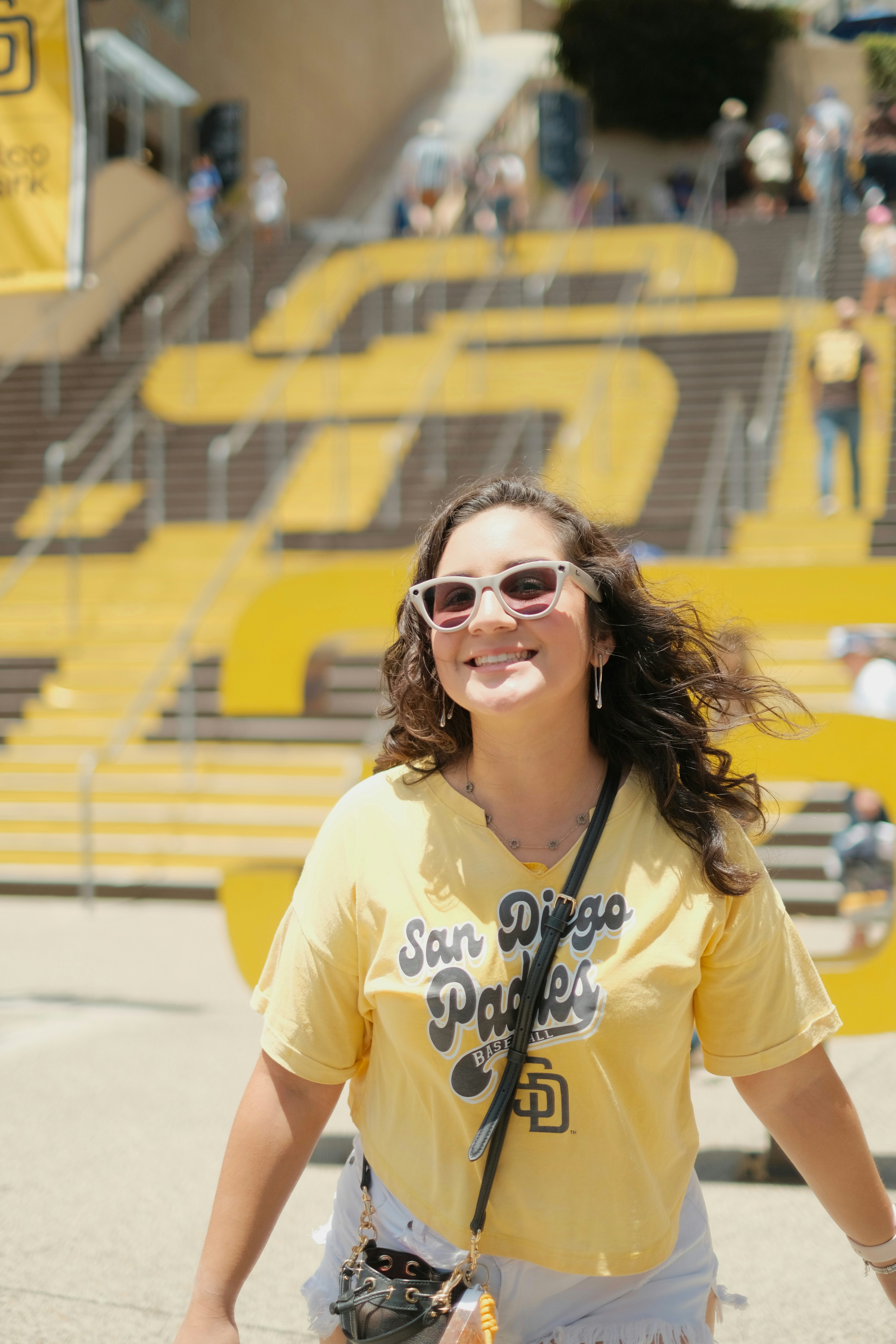 Sunny SDSU Spirit: A Laughing Portrait in Front of Golden Steps