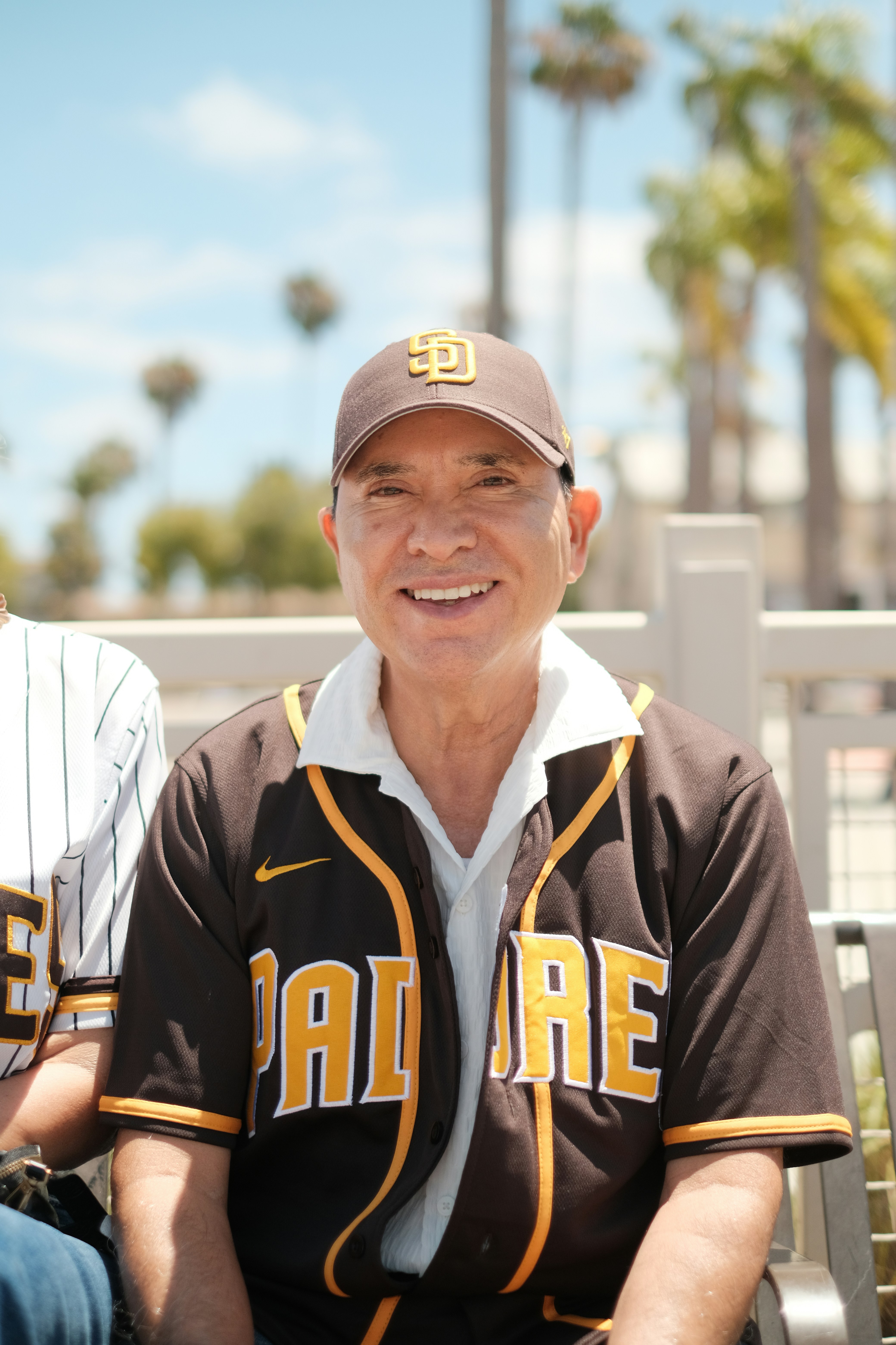 Baseball Cap and San Diego Outfit: A Friendly Portrait at the Park
