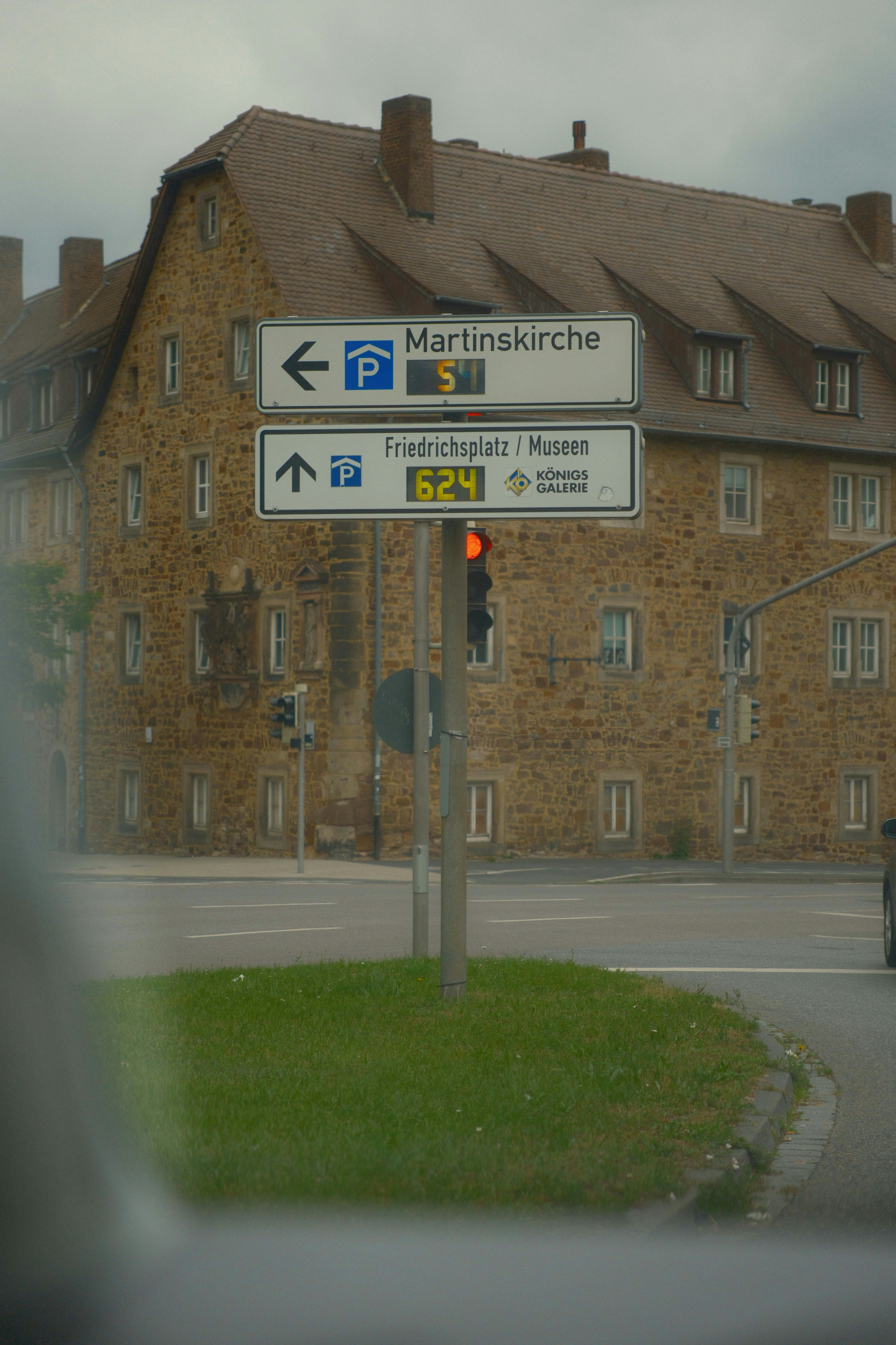 Signpost Symphony: Directional Cues Against a Stone Facade