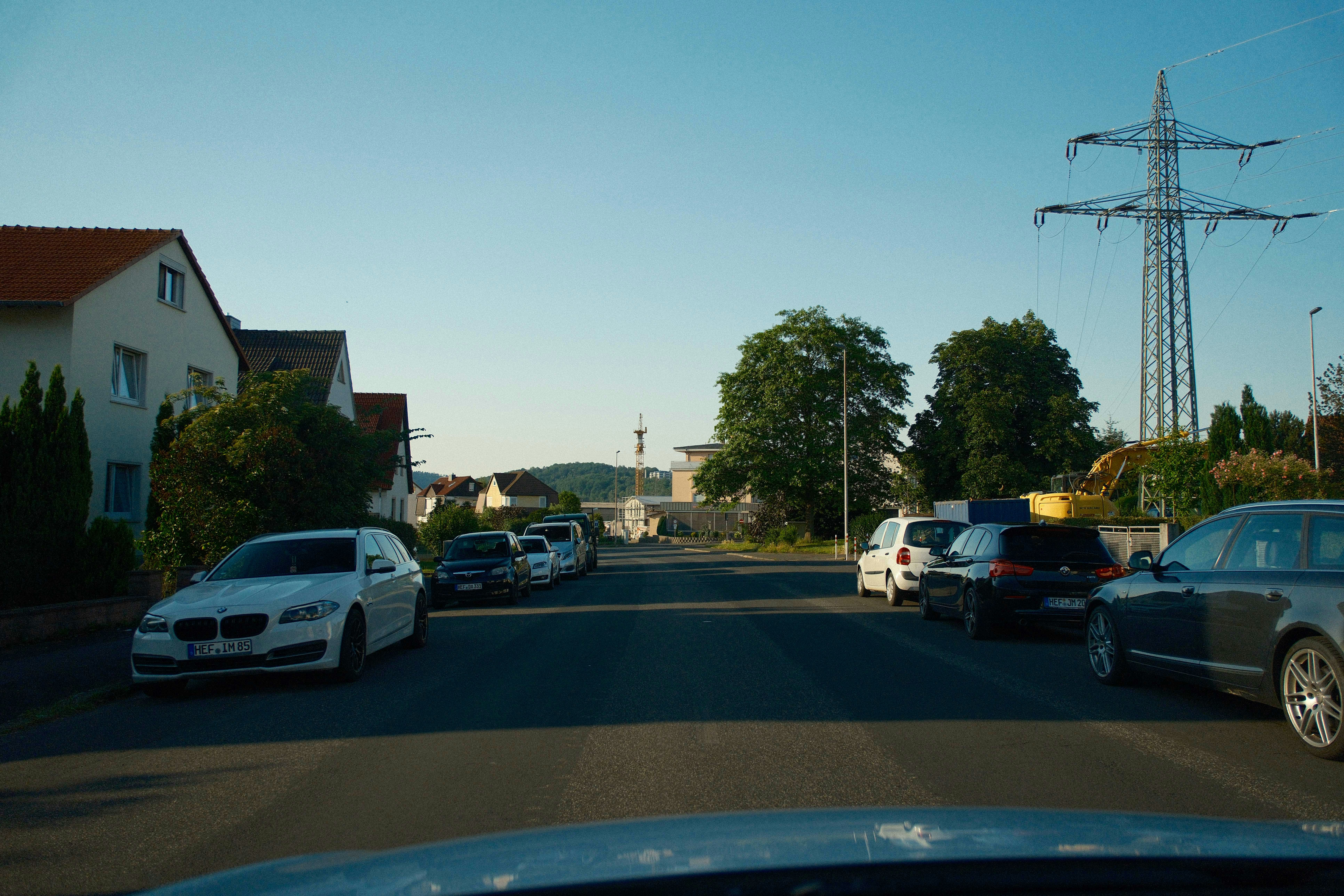 Morning Street Between Quiet Rows: A Down-the-Block View