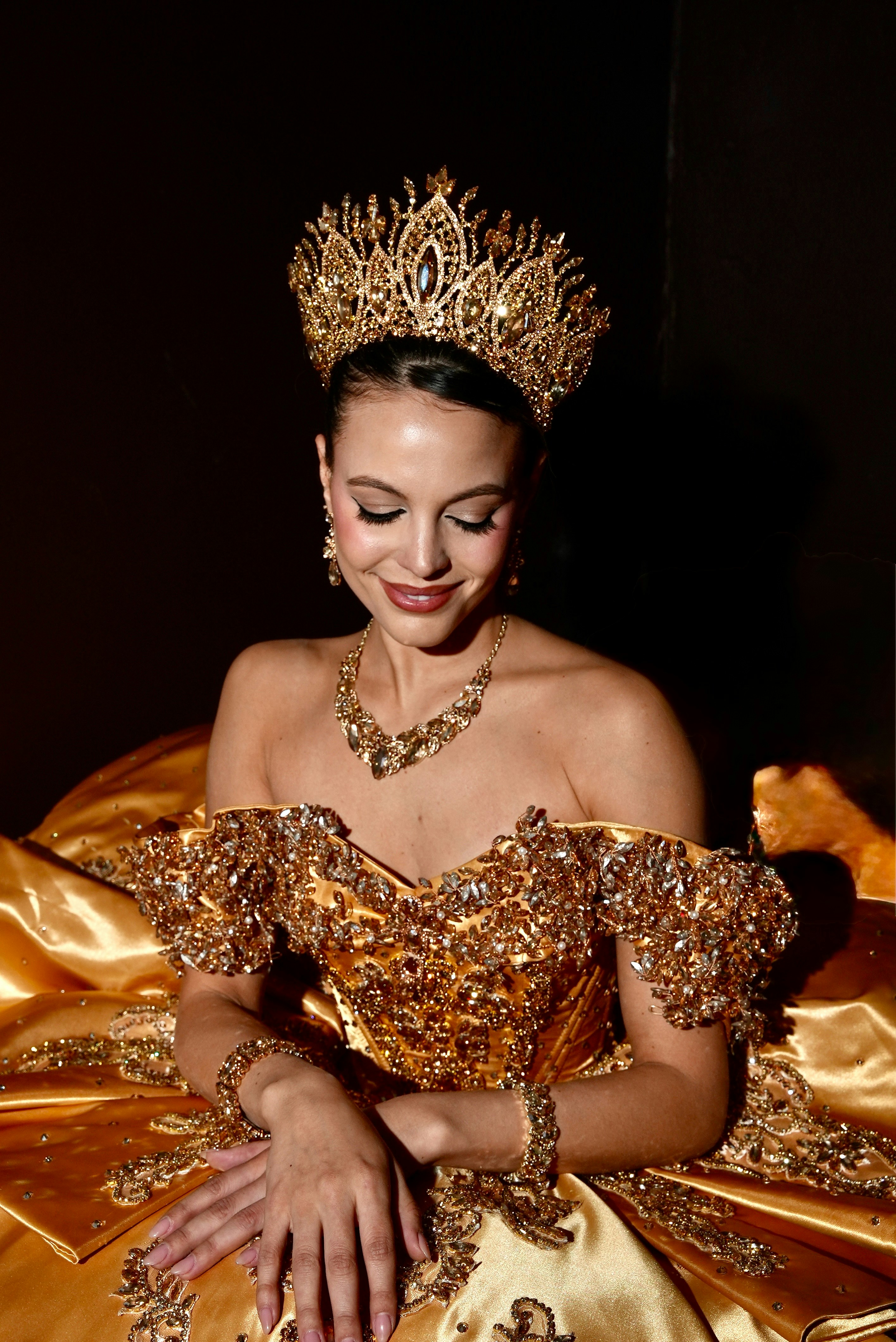 Regal Glow: Golden Crown and Gown in Velvet Night