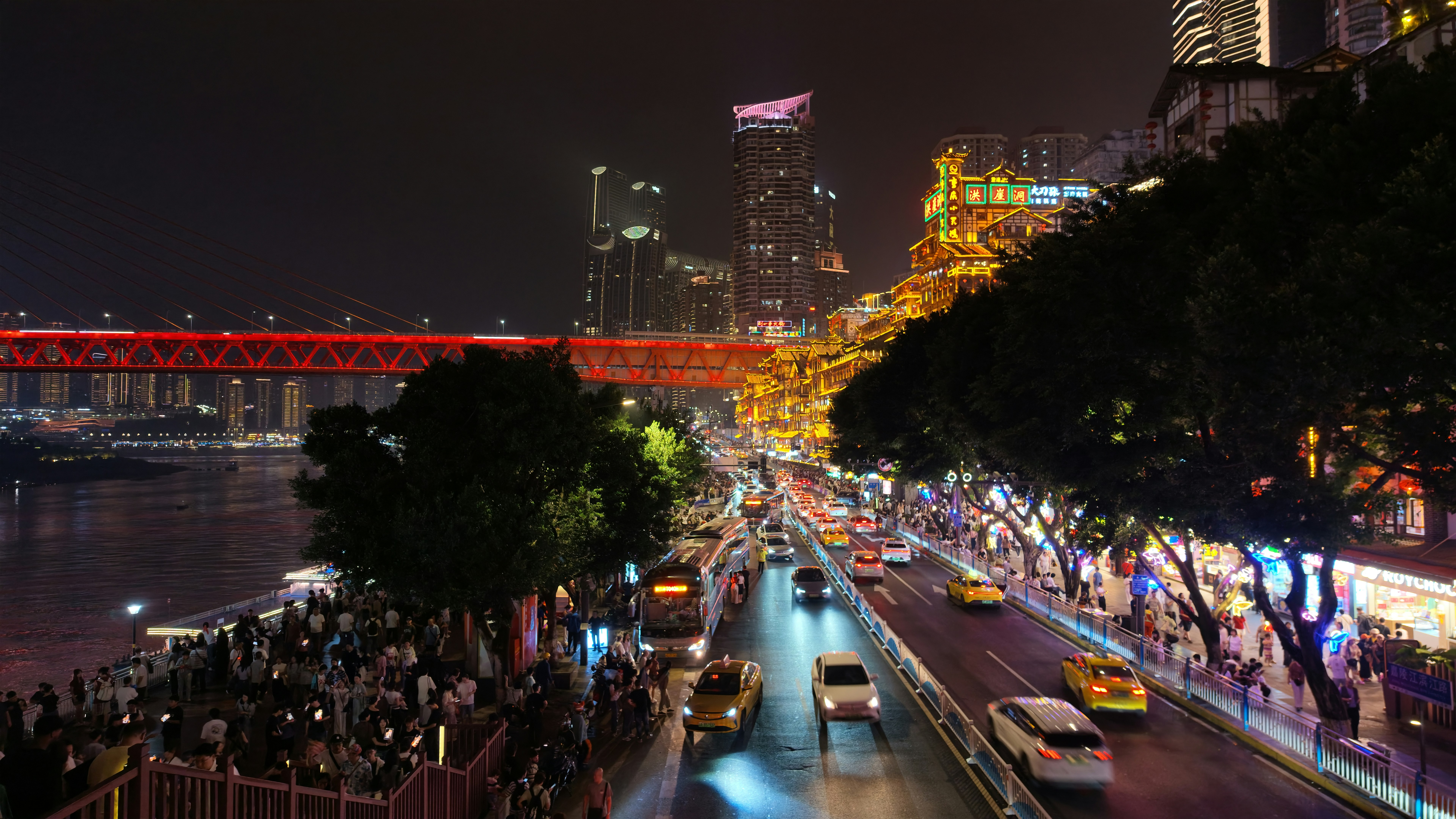 Urban Pulse Under Neon Skies: A Riverfront at Night